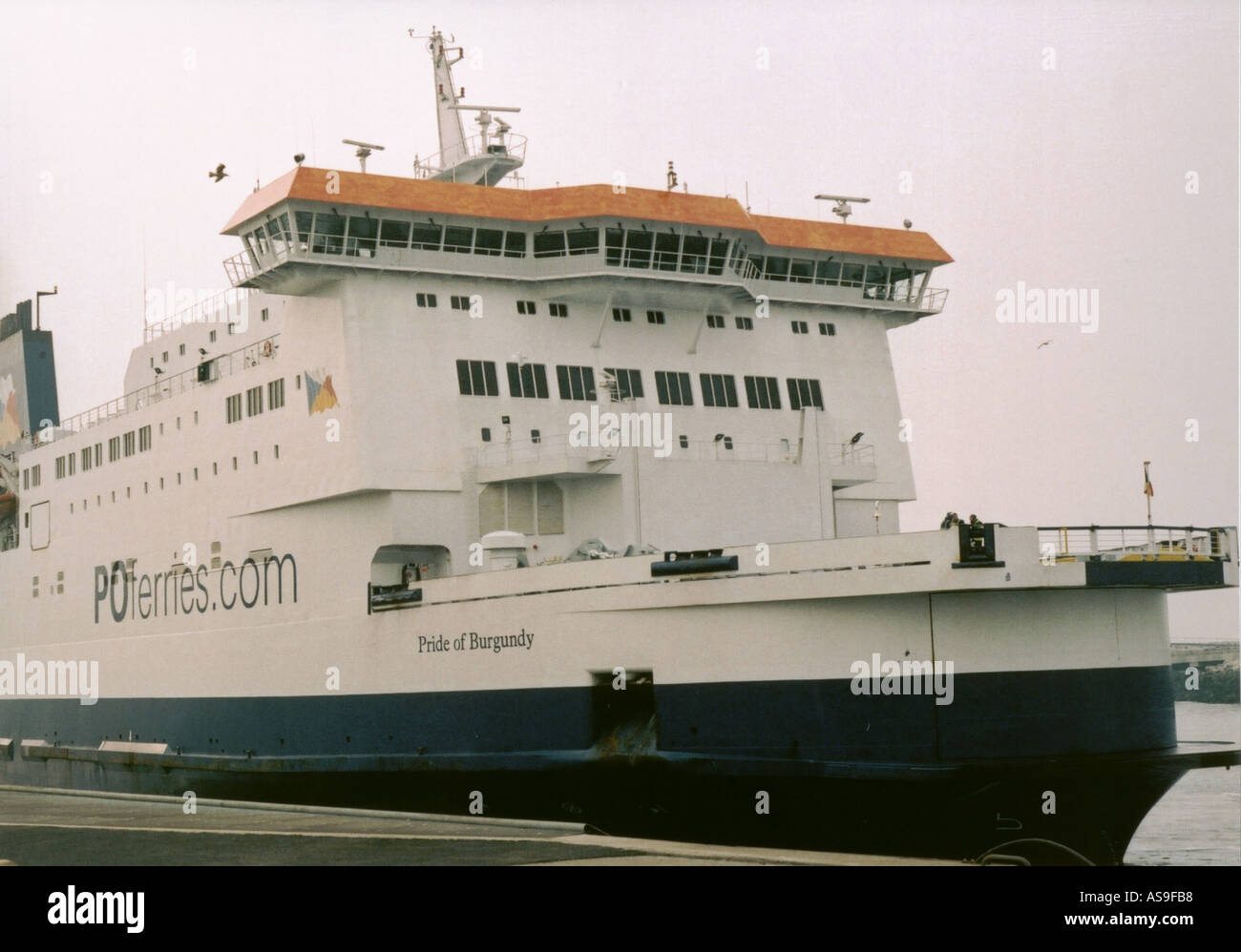 Cross channel ferry unloading and cars waiting to load at Calais in ...