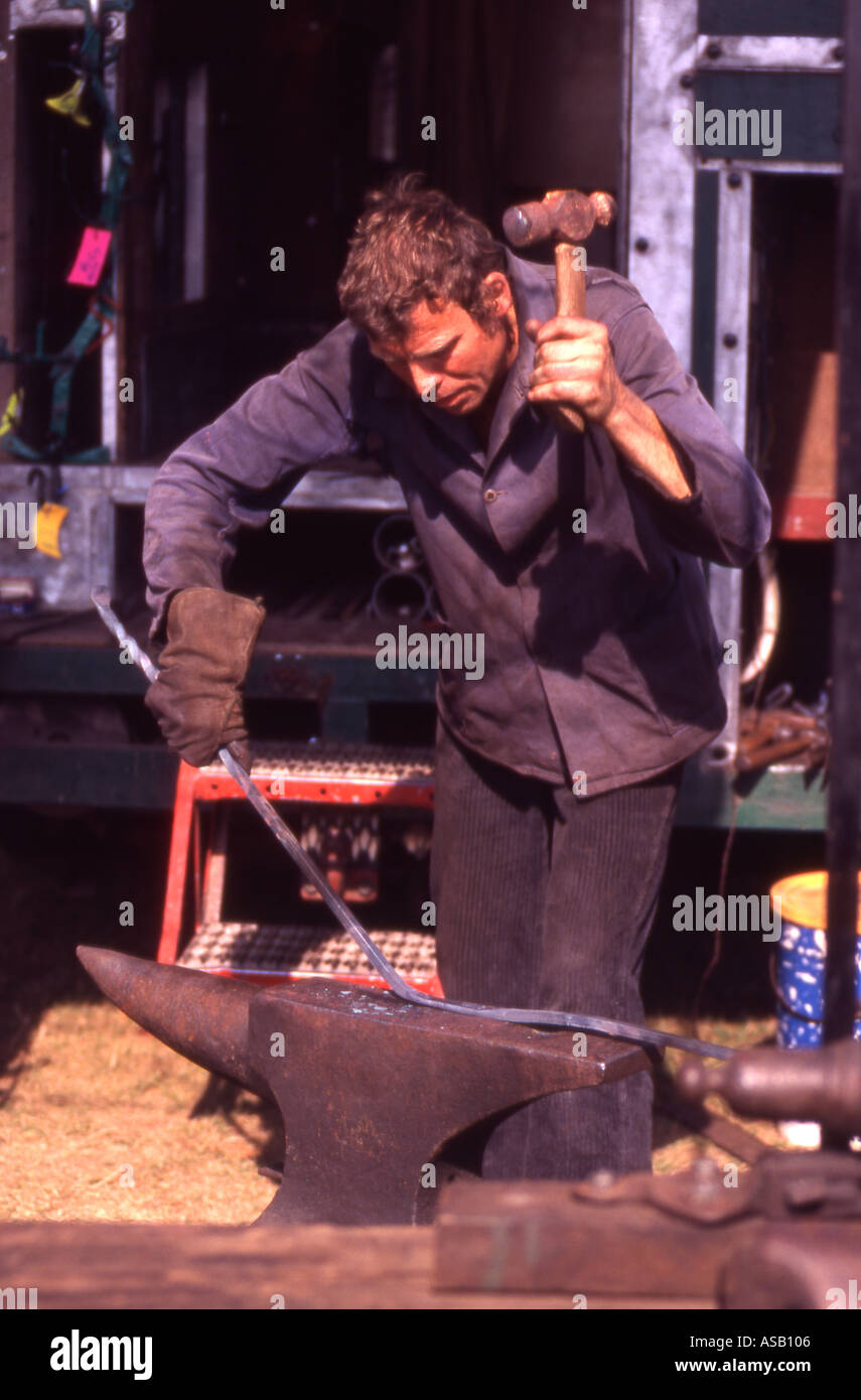 Blacksmith working at an anvil Stock Photo - Alamy