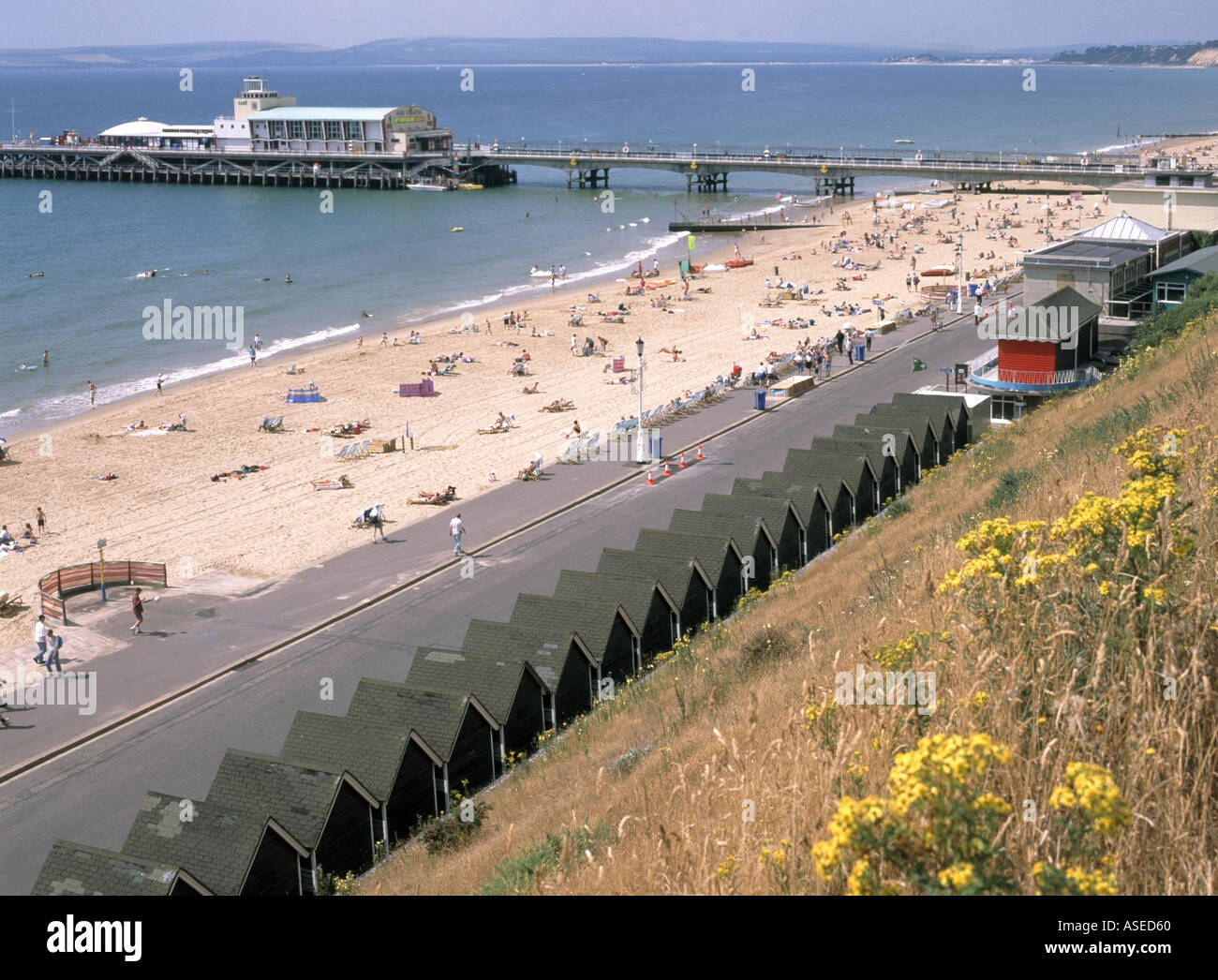 Bournemouth seaside holiday resort with beach huts and sandy shore line ...