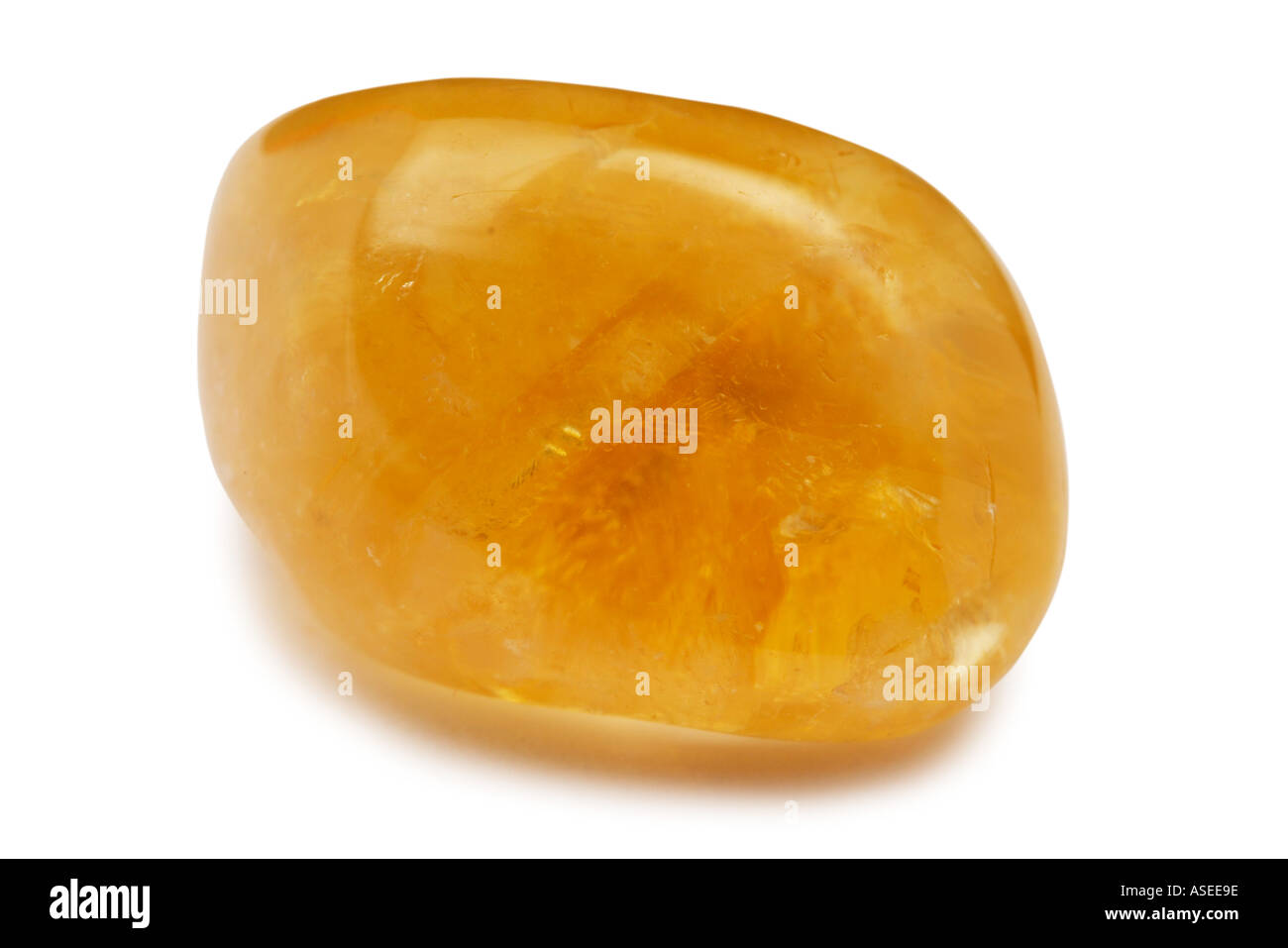 Honey Calcite tumble smoothed mineral sample Stock Photo - Alamy