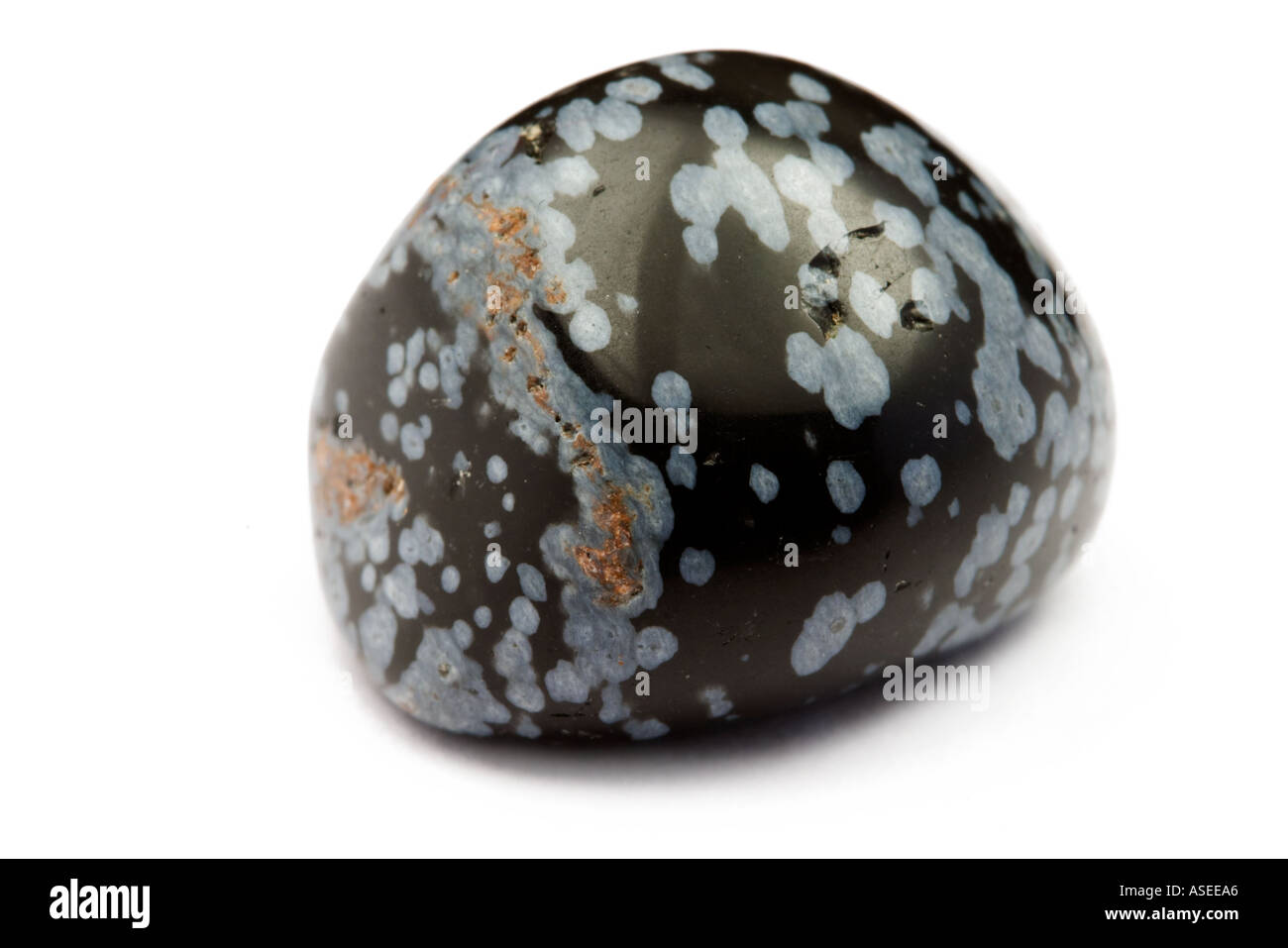 Snowflake Obsidian tumble smoothed mineral sample Stock Photo - Alamy