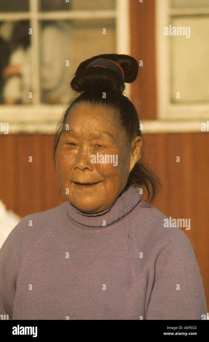 Eskimo Inuit woman with her hair tied in the traditional topknot ...