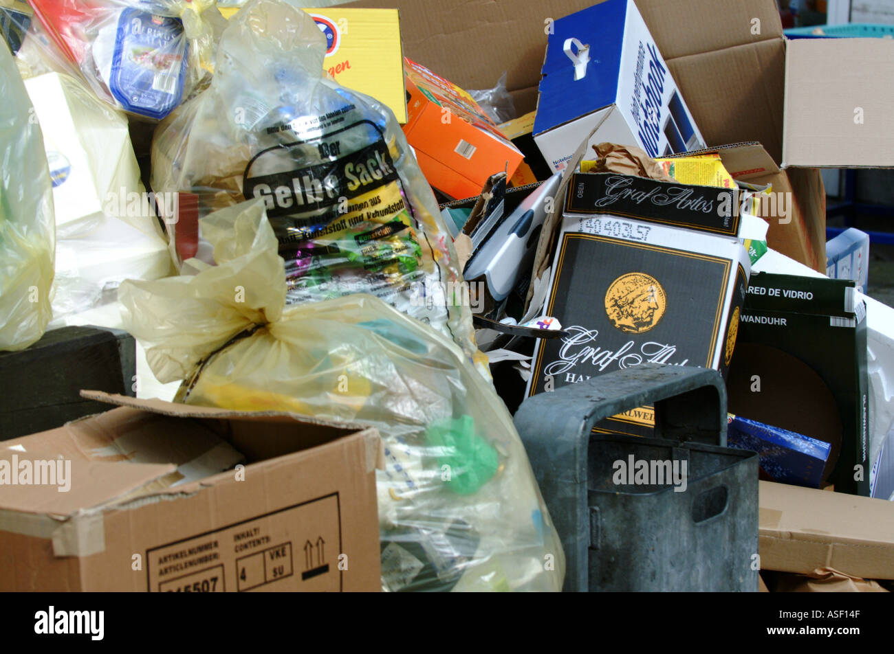 a street piled high with trash Stock Photo - Alamy