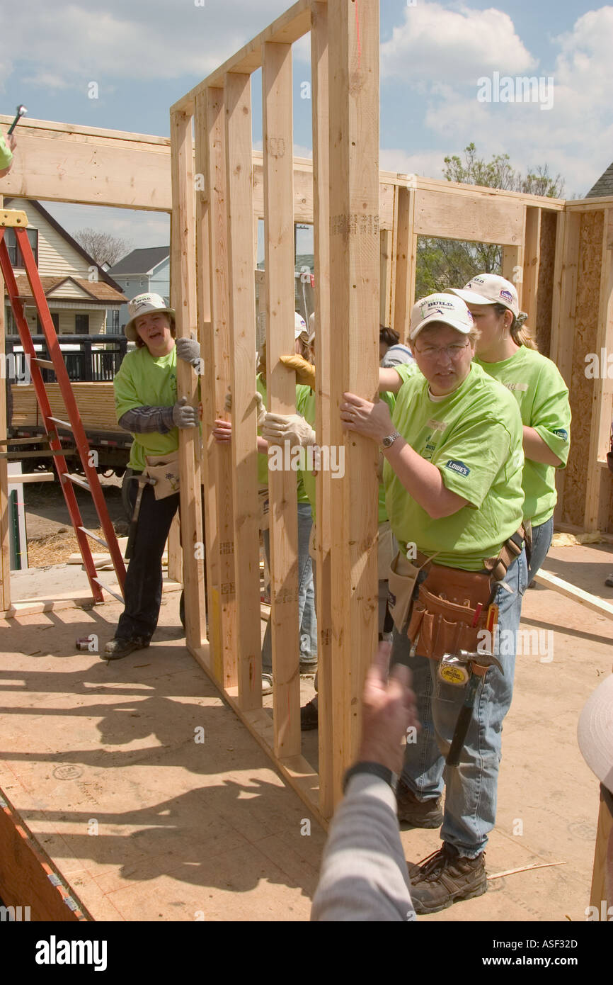 Women volunteers help build house for low income family through Habitat ...