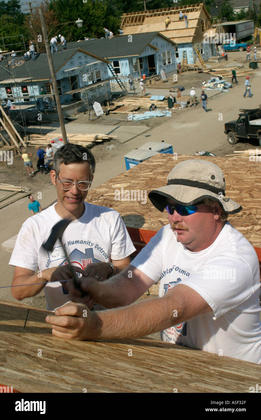 Volunteers help build house for low income family through Habitat for ...