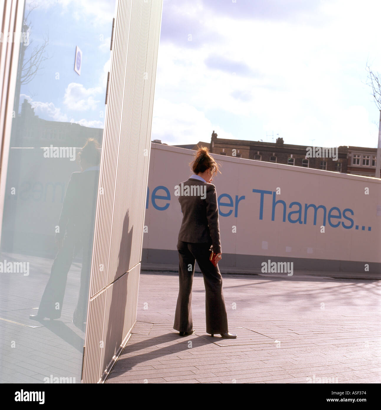 Woman smoking outside office hi-res stock photography and images - Alamy