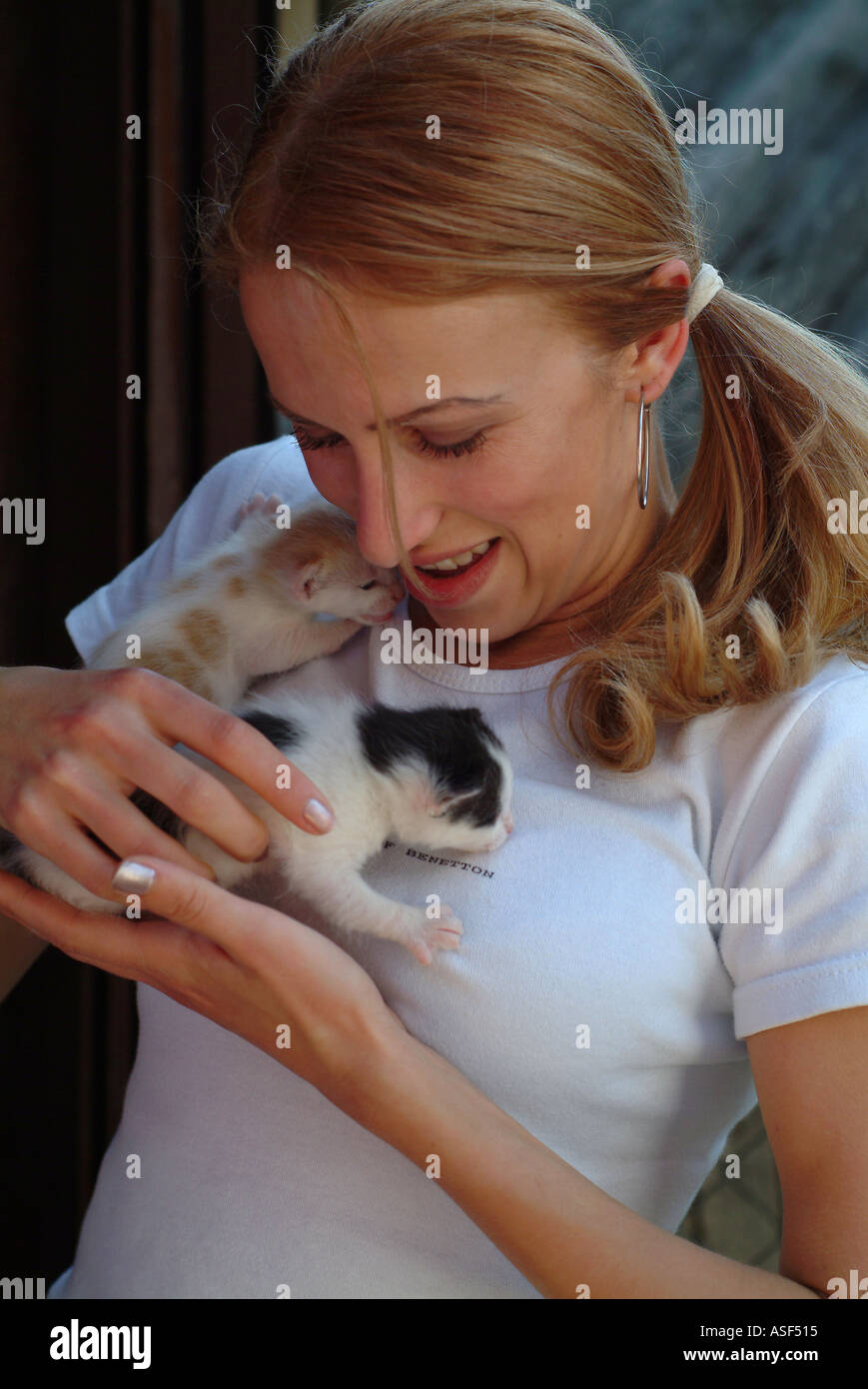 Woman with two cats hi-res stock photography and images - Alamy