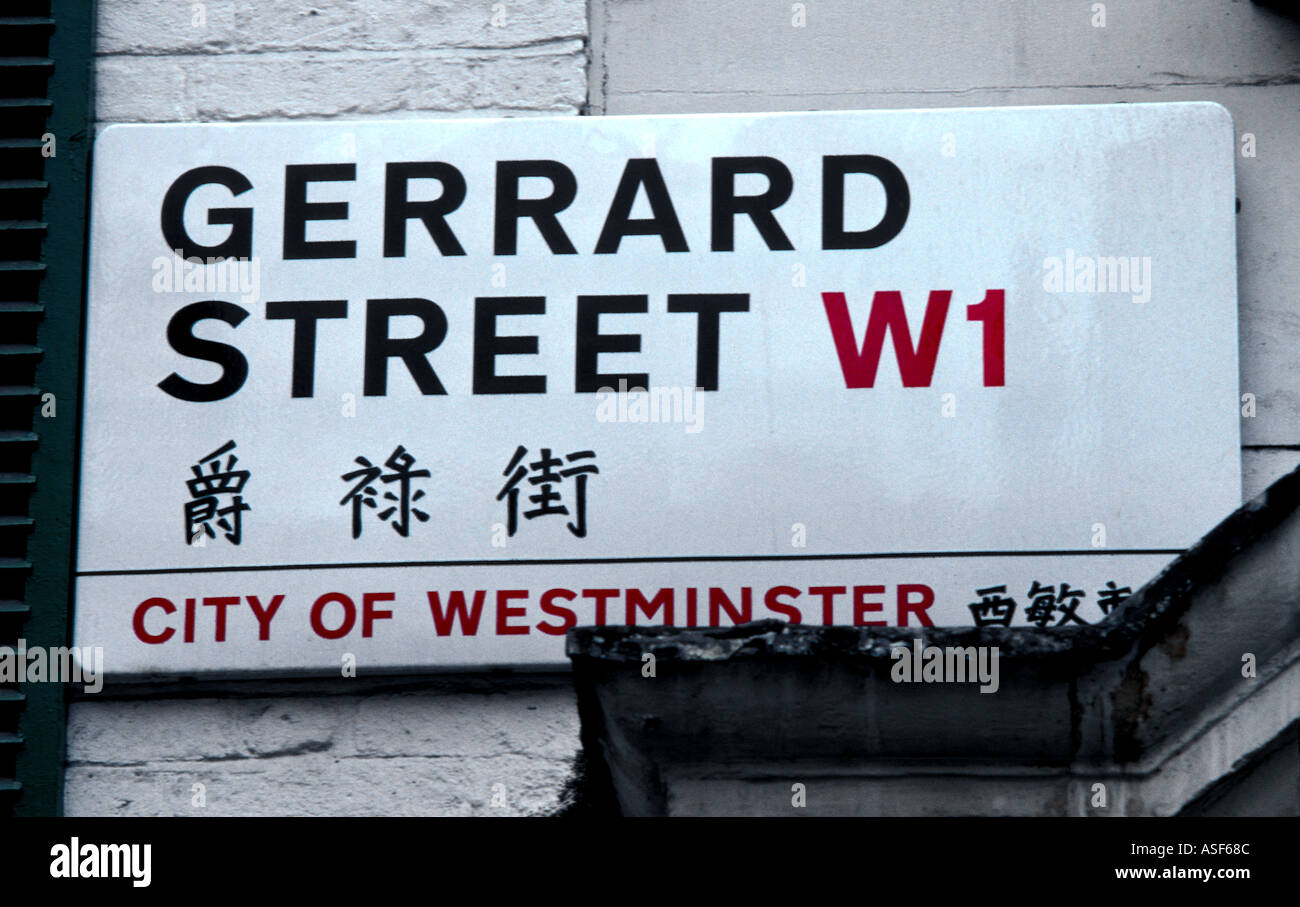 Street sign in London's China Town in English and Chinese Mandarin ...