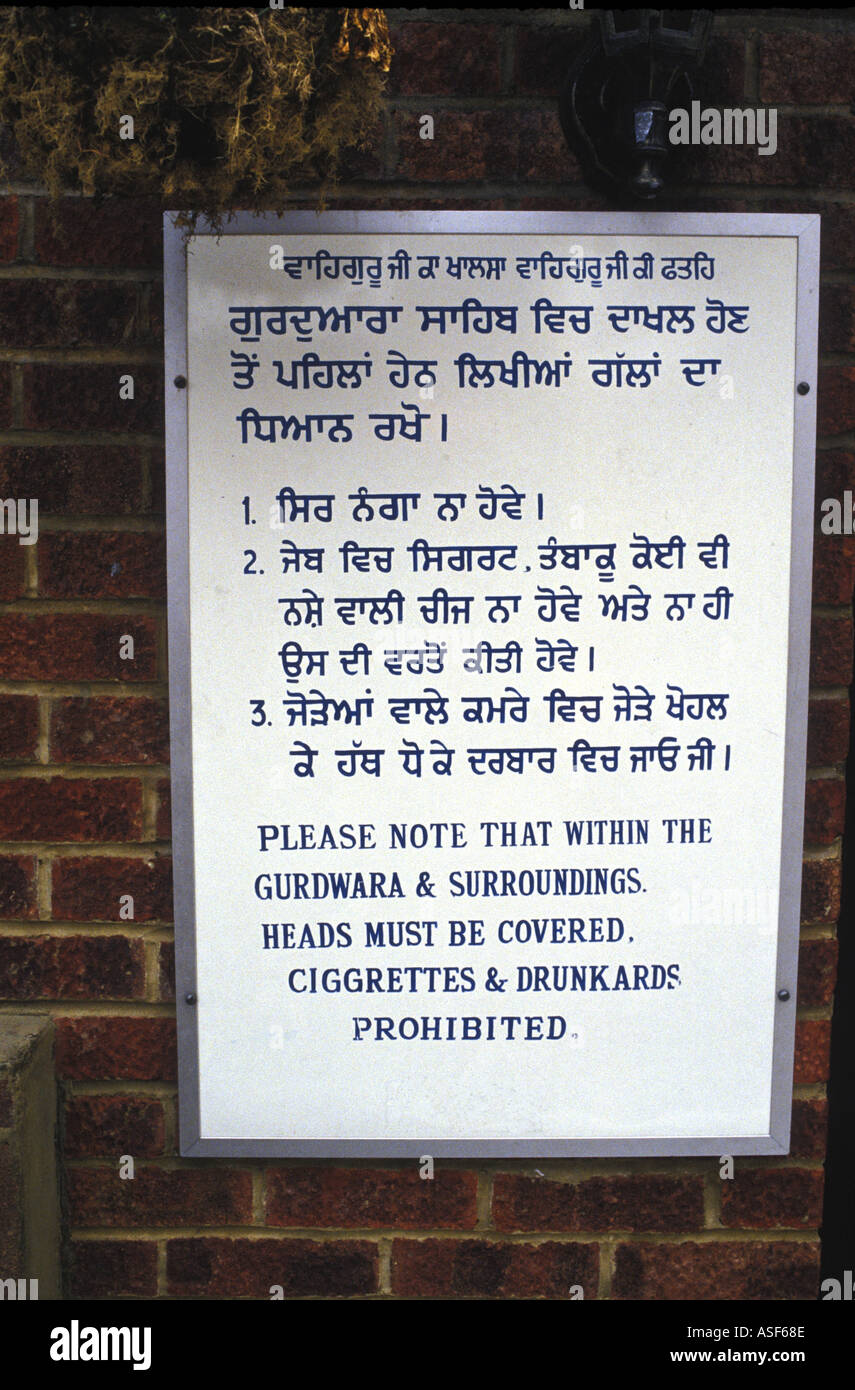 Sign outside Sikh Temple London in English and Punjabi Stock Photo - Alamy