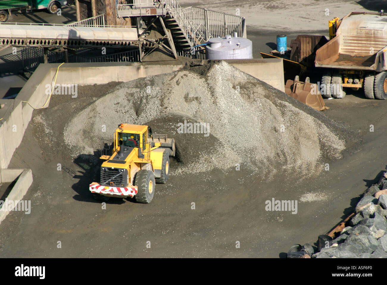 Digger Working at Gravel Storage Yard Stock Photo - Alamy