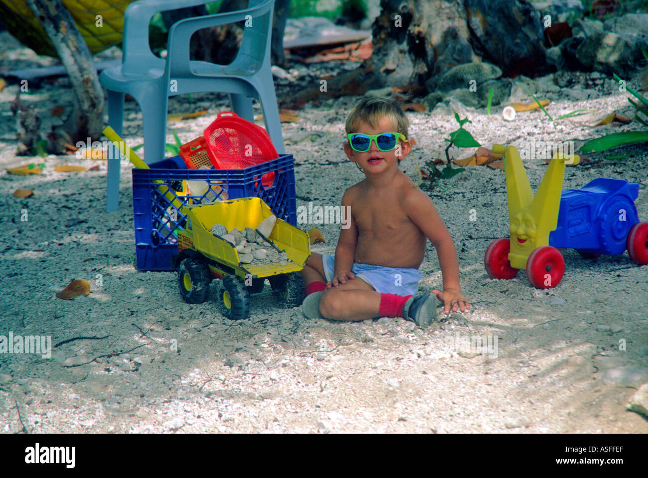 Cool baby playing in the shade wearing shades Stock Photo - Alamy