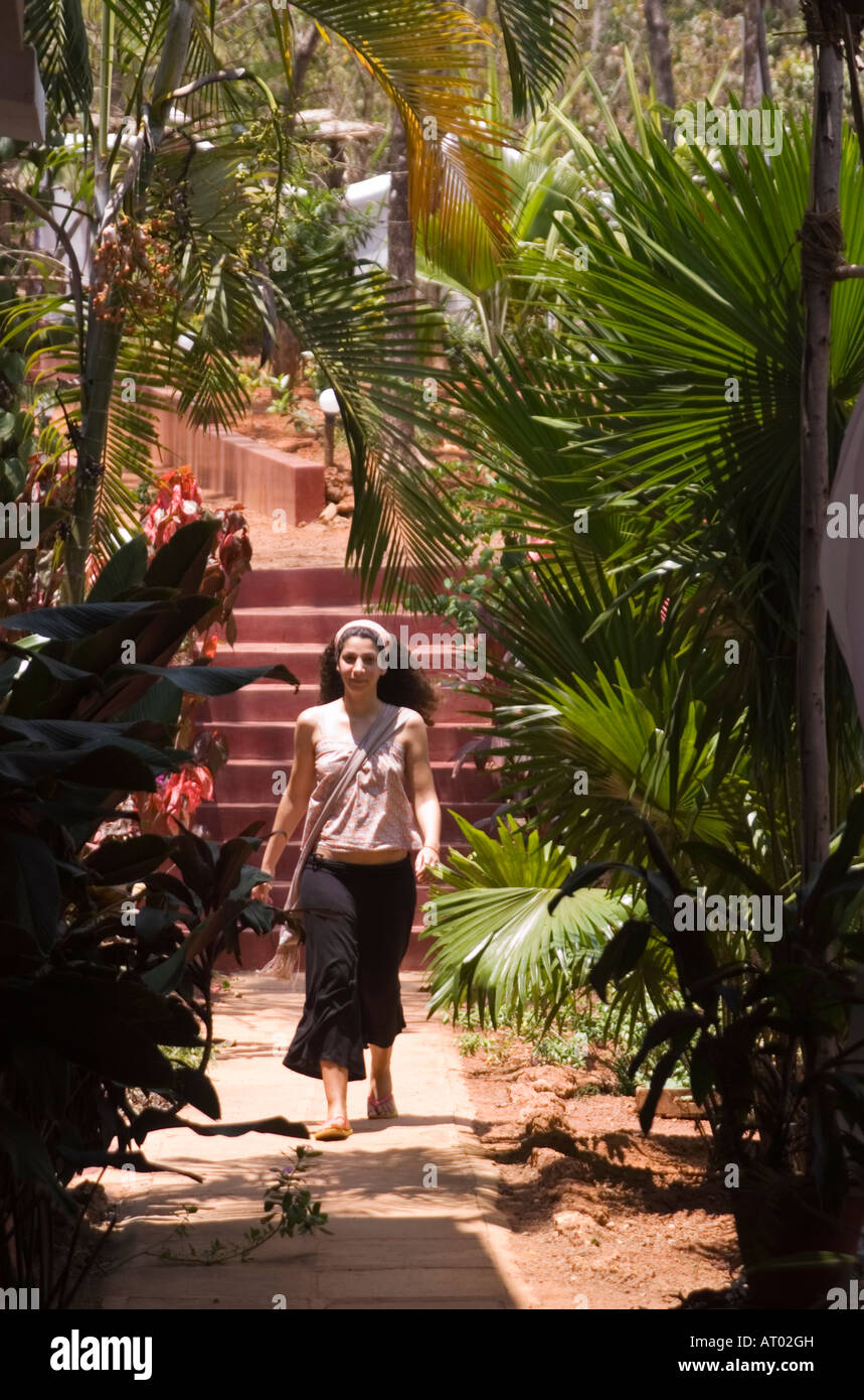 3575 Goa India girl walking through shady trees Stock Photo - Alamy