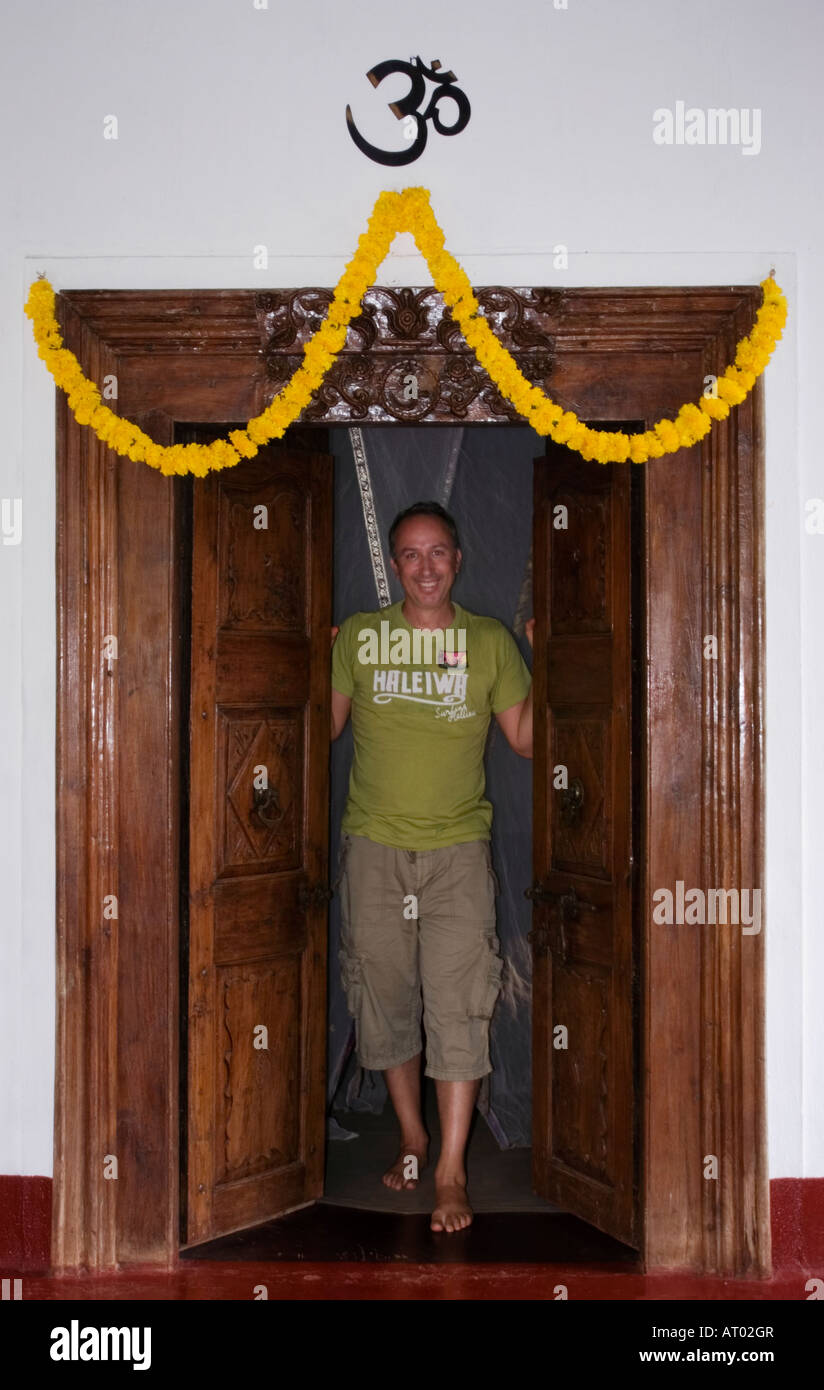 3575 Goa India man standing in entrance double door to yoga shala Stock ...