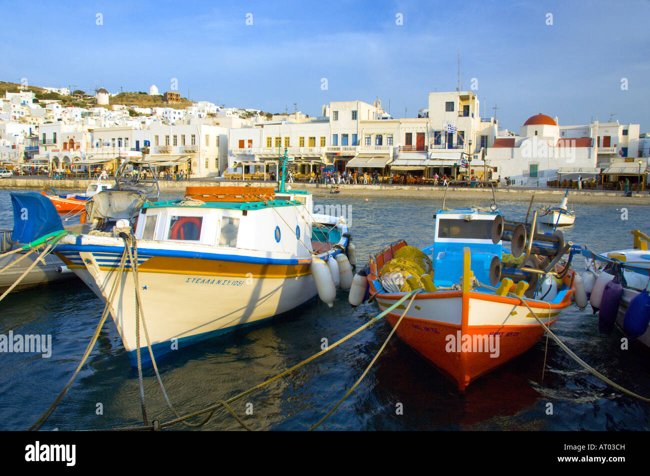 The port of Hora with colorful fishing boats on the Greek Island of ...