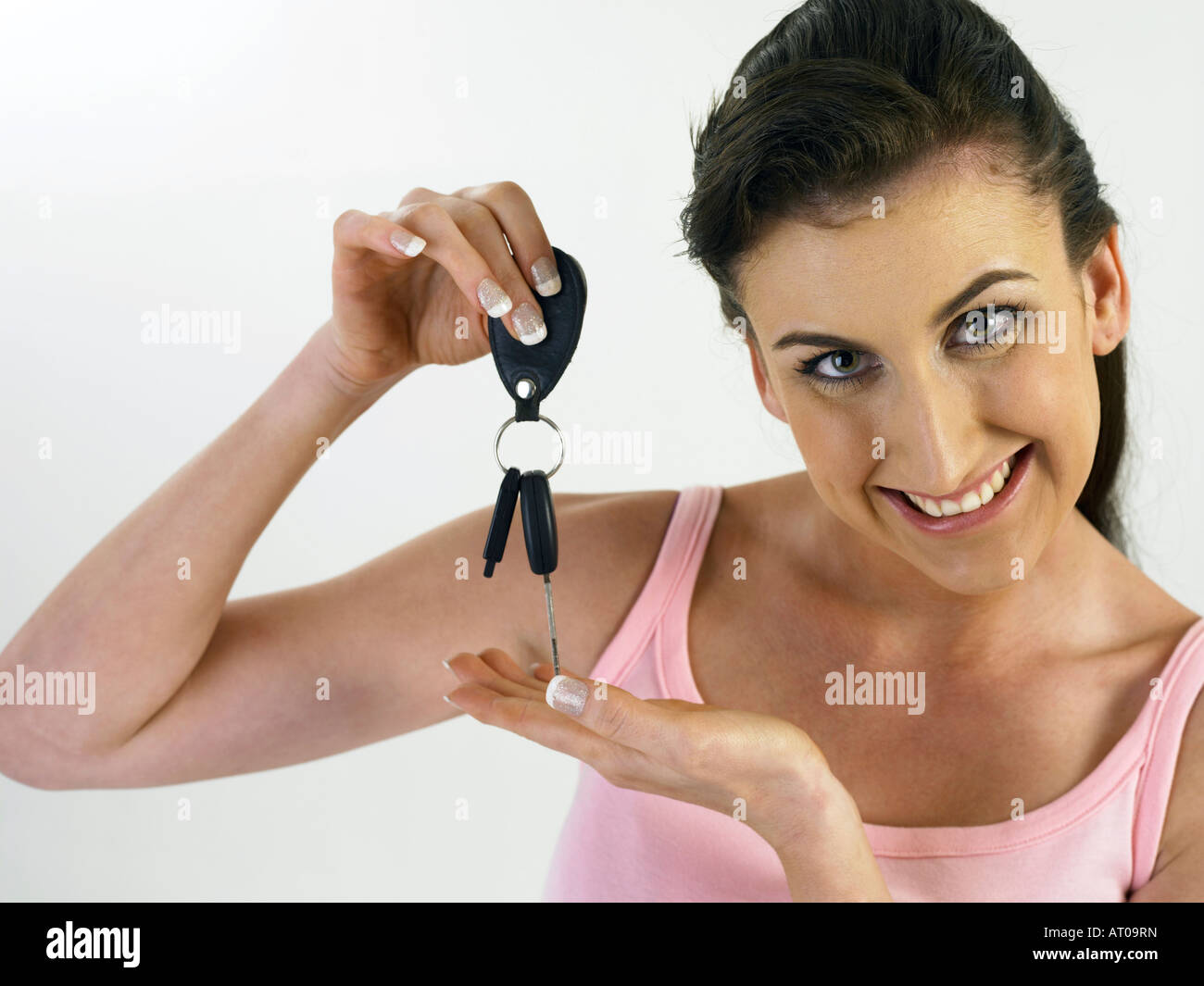Excited young woman holds up hi-res stock photography and images - Alamy