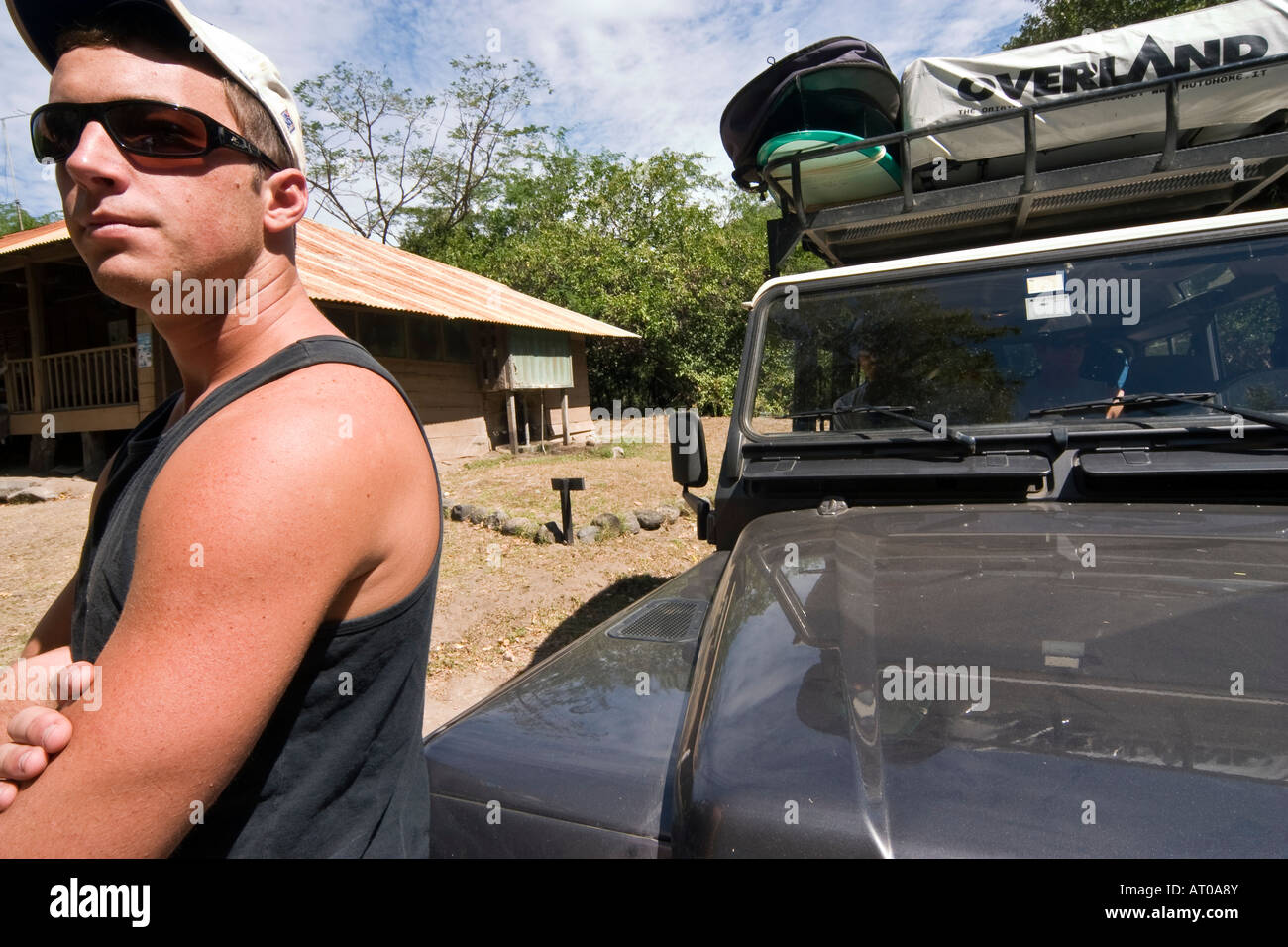 A surf guide waits by the 4WD vehicle at the rangers lodge in Santa ...