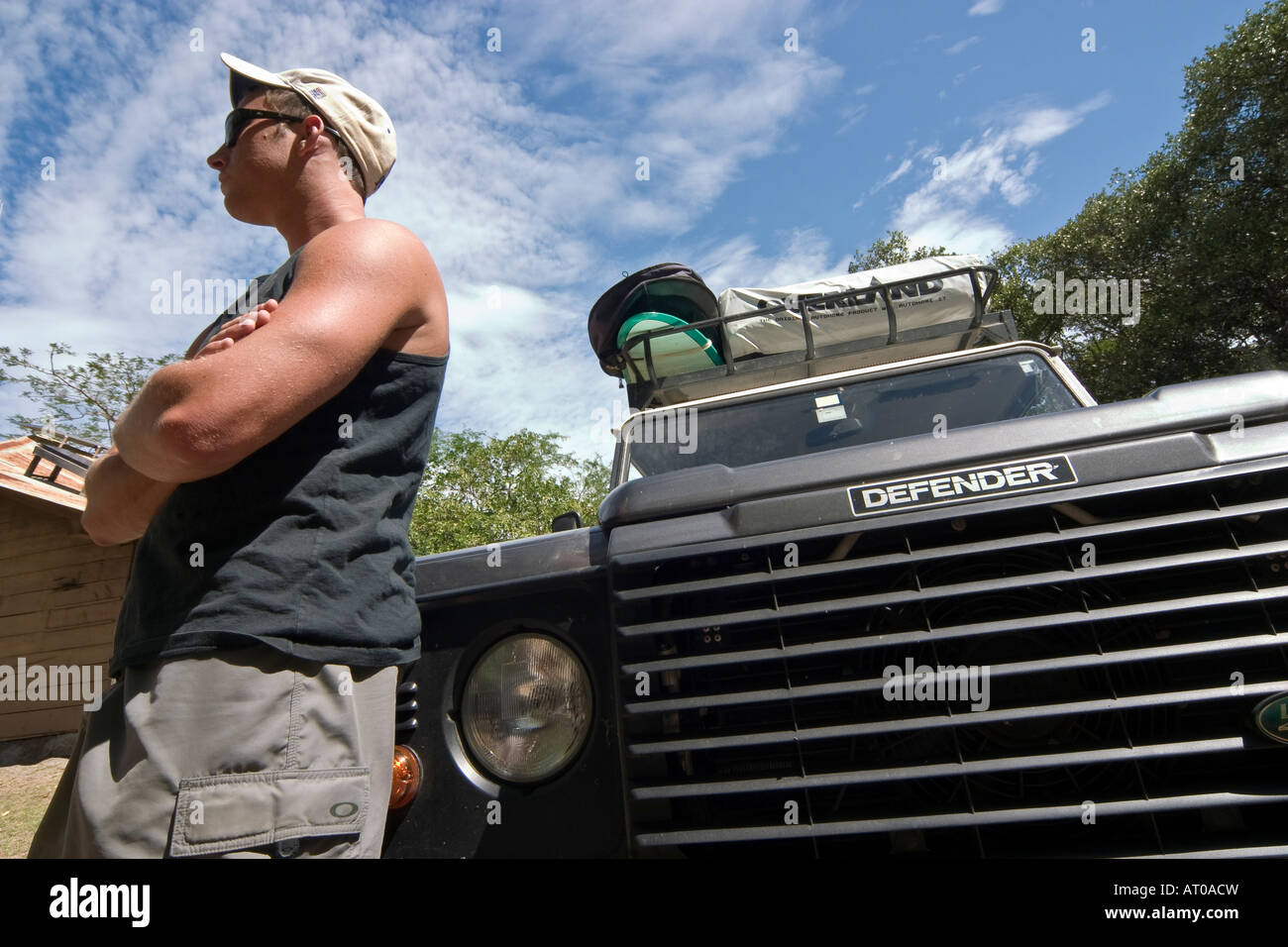 A surf guide waits by the 4WD vehicle at the rangers lodge in Santa ...
