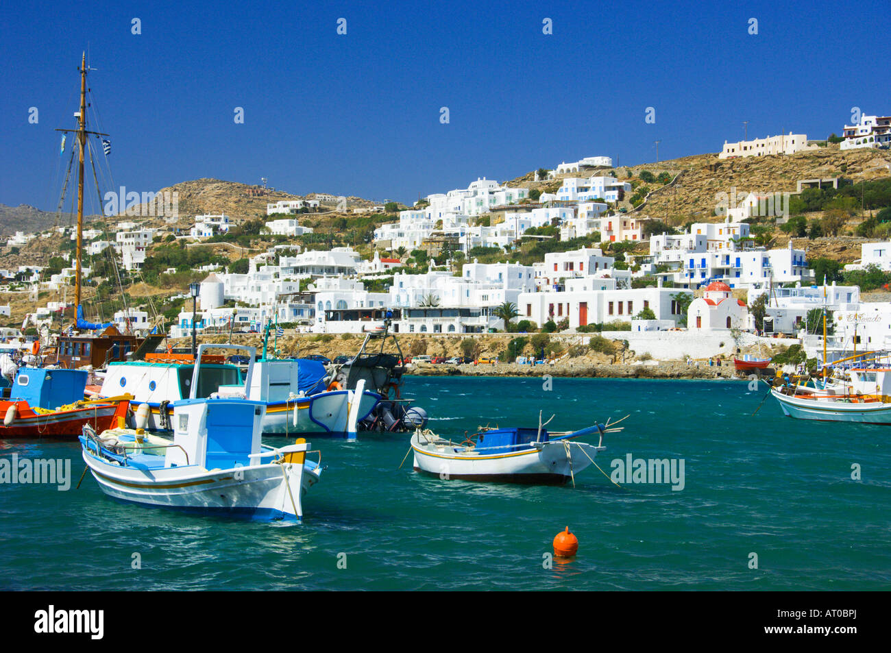 The port of Hora with colorful fishing boats on the Greek Island of ...