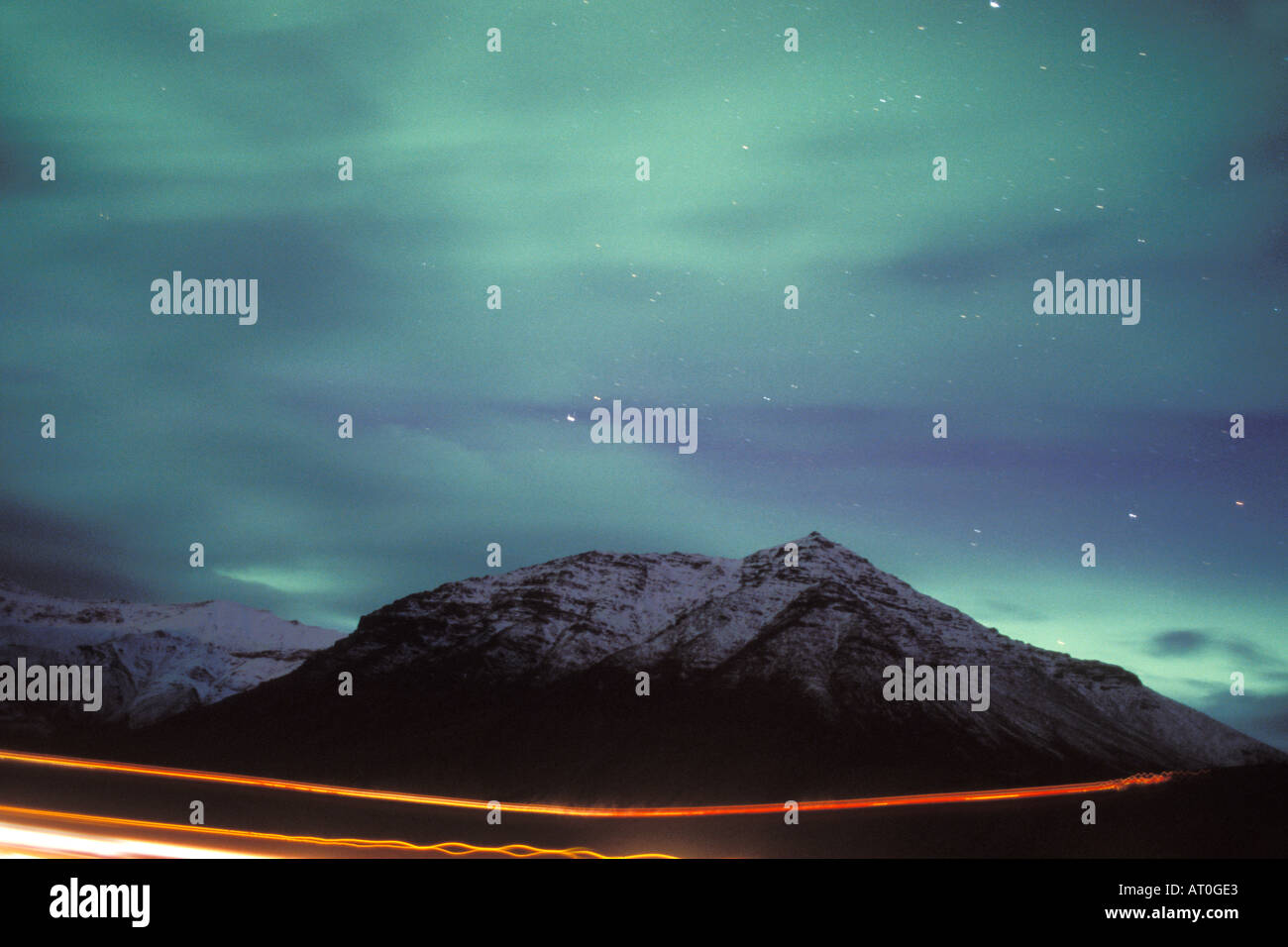 northern lights Aurora borealis and truck lights at Atigun Pass North ...