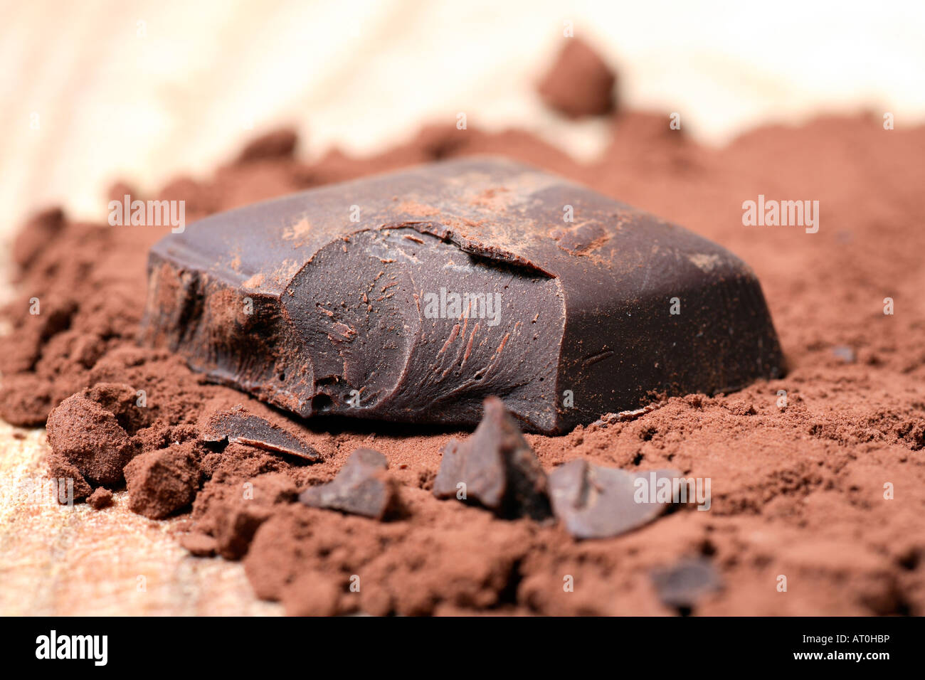 A piece of dark chocolate in cocoa powder Stock Photo - Alamy