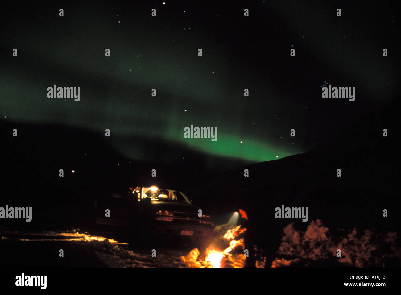 northern lights Aurora borealis over campsite on Atigun Pass North ...