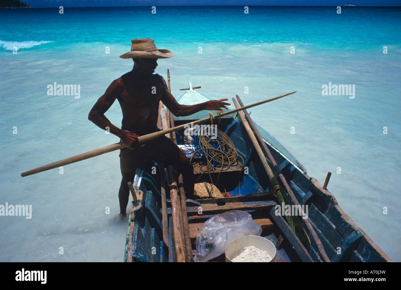 Fisherman preparing his boat in the Seychelles Stock Photo - Alamy