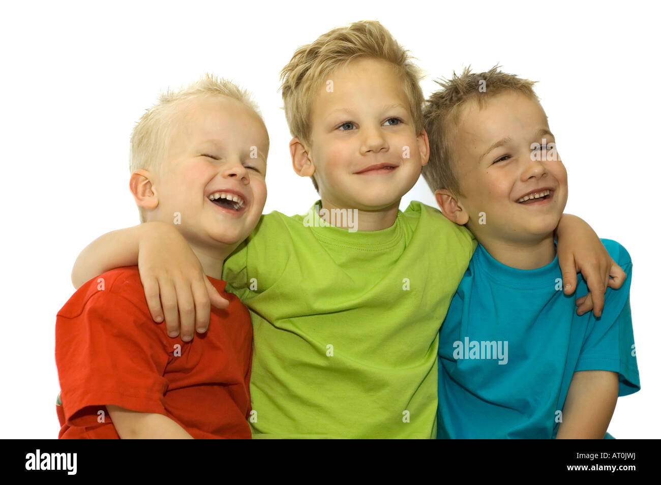 Three friends laughing holding each other and having fun Stock Photo ...