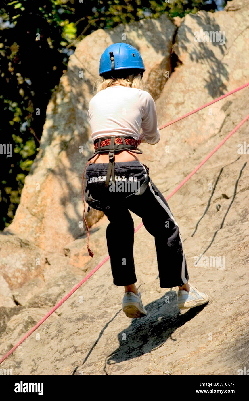 little girl female climbing a rock Stock Photo - Alamy
