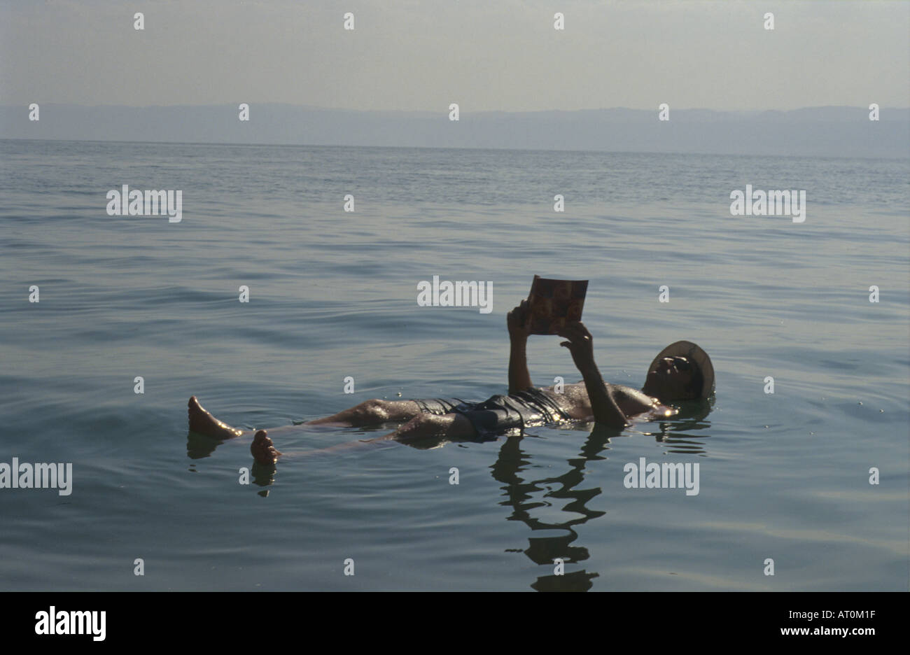 Man floating at Dead Sea Jordan Stock Photo - Alamy