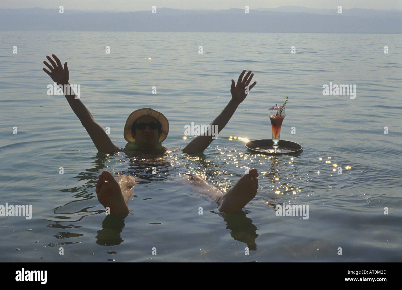 Man floating at Dead Sea Jordan Stock Photo - Alamy