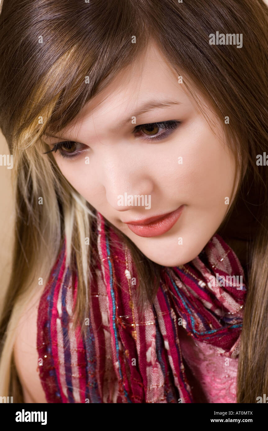 Beautiful young woman looking down Stock Photo - Alamy