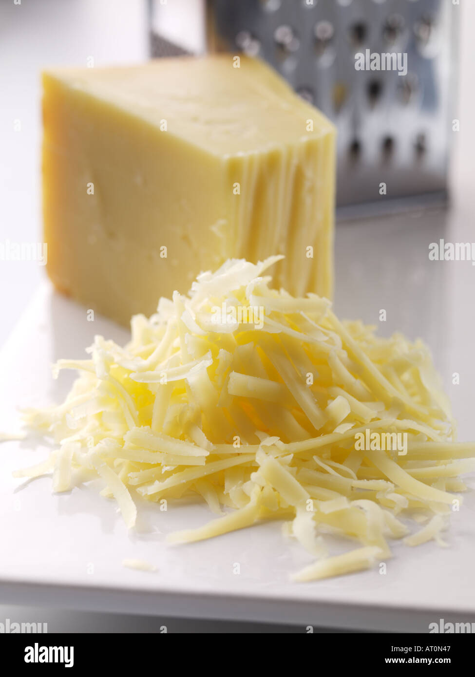 Cheddar cheese block metal cheese grater hi-res stock photography and ...