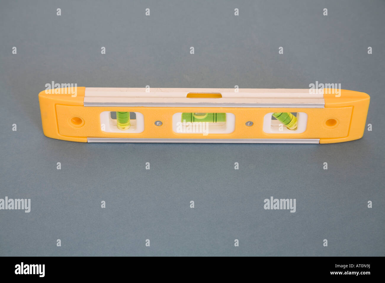 Studio Still life Close up a three angled yellow spirit level Stock ...