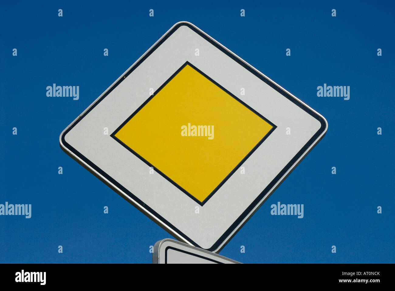 PRIORITY ROAD TRAFFIC SIGN ON BLUE SKY Stock Photo - Alamy