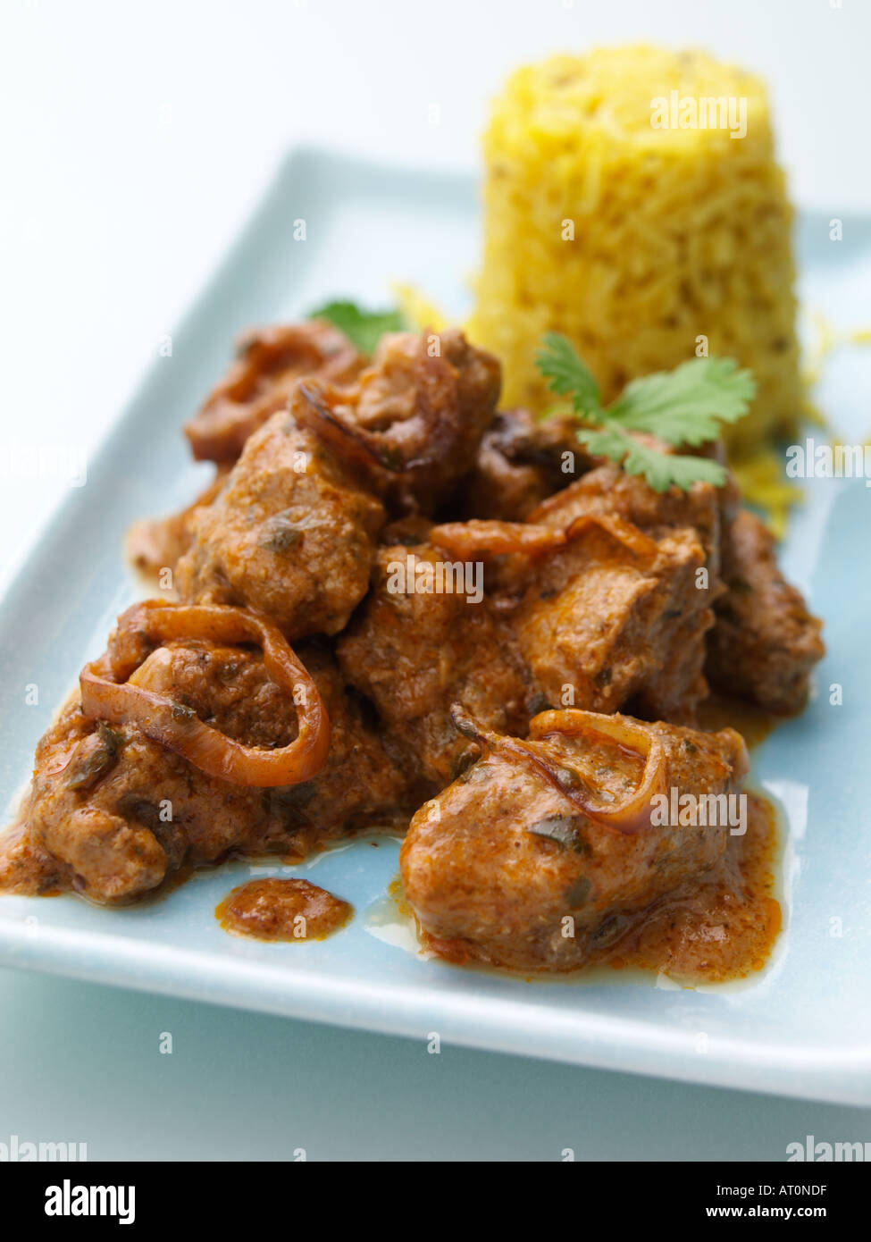 Lamb rogan josh with pilau rice Stock Photo - Alamy