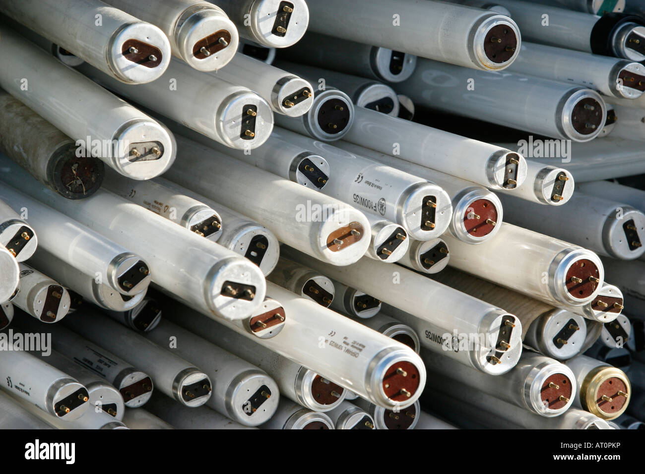 Stack of used fluorescent light tubes in a recycling centre Stock Photo ...
