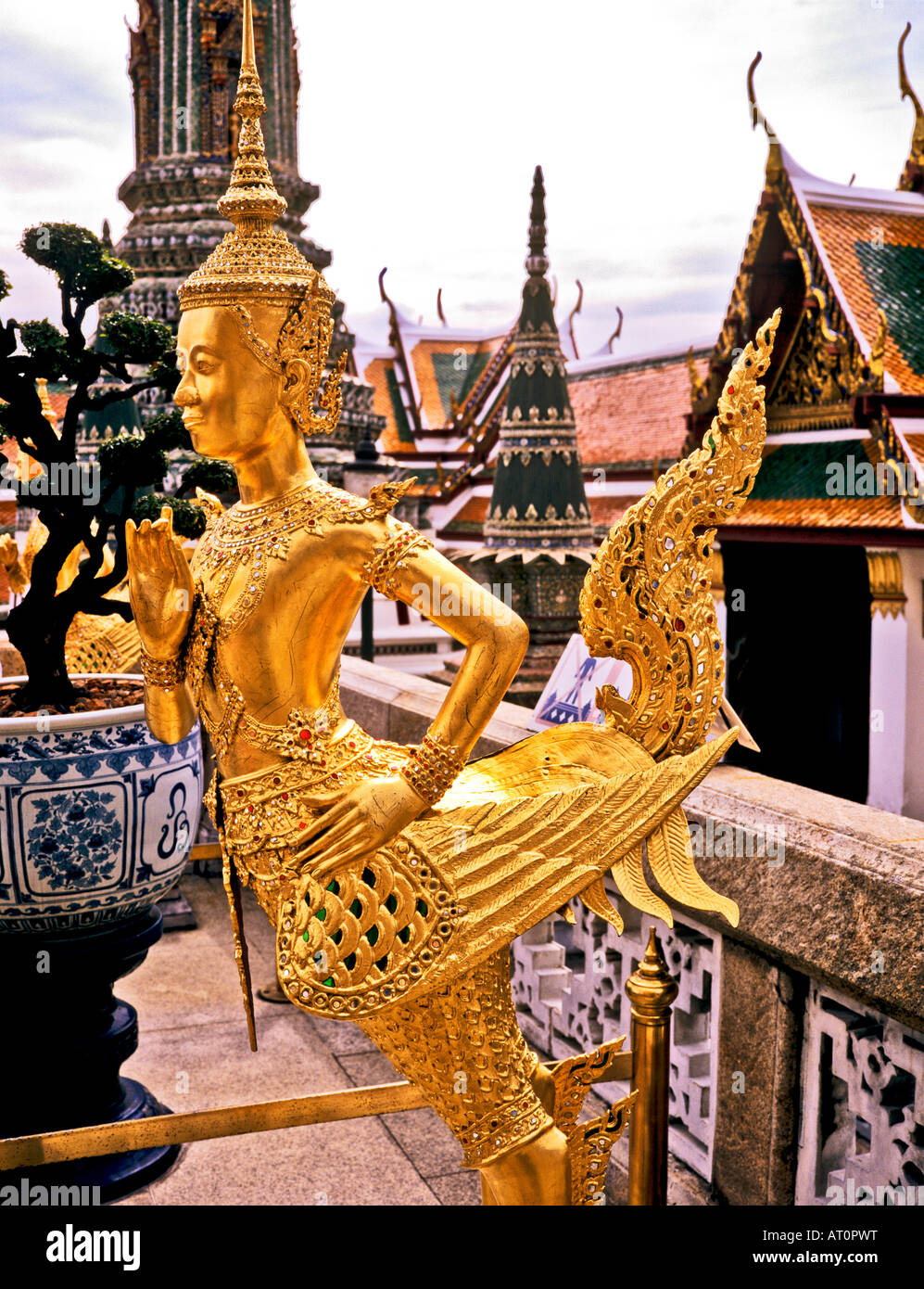 Gilded mythological figure Apsonsi in the Grand Palace Bangkok Thailand ...