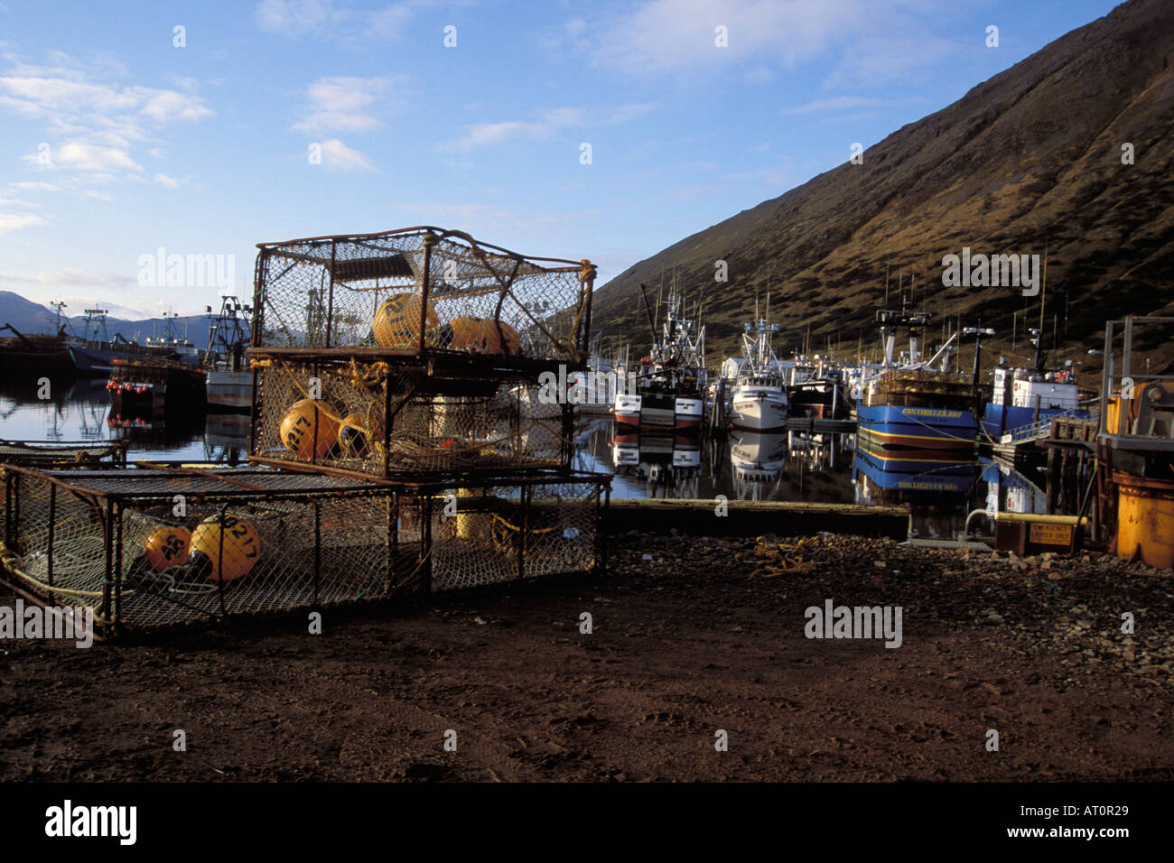 King Cove dock with crab pots on the end of the Alaskan Peninsula and ...