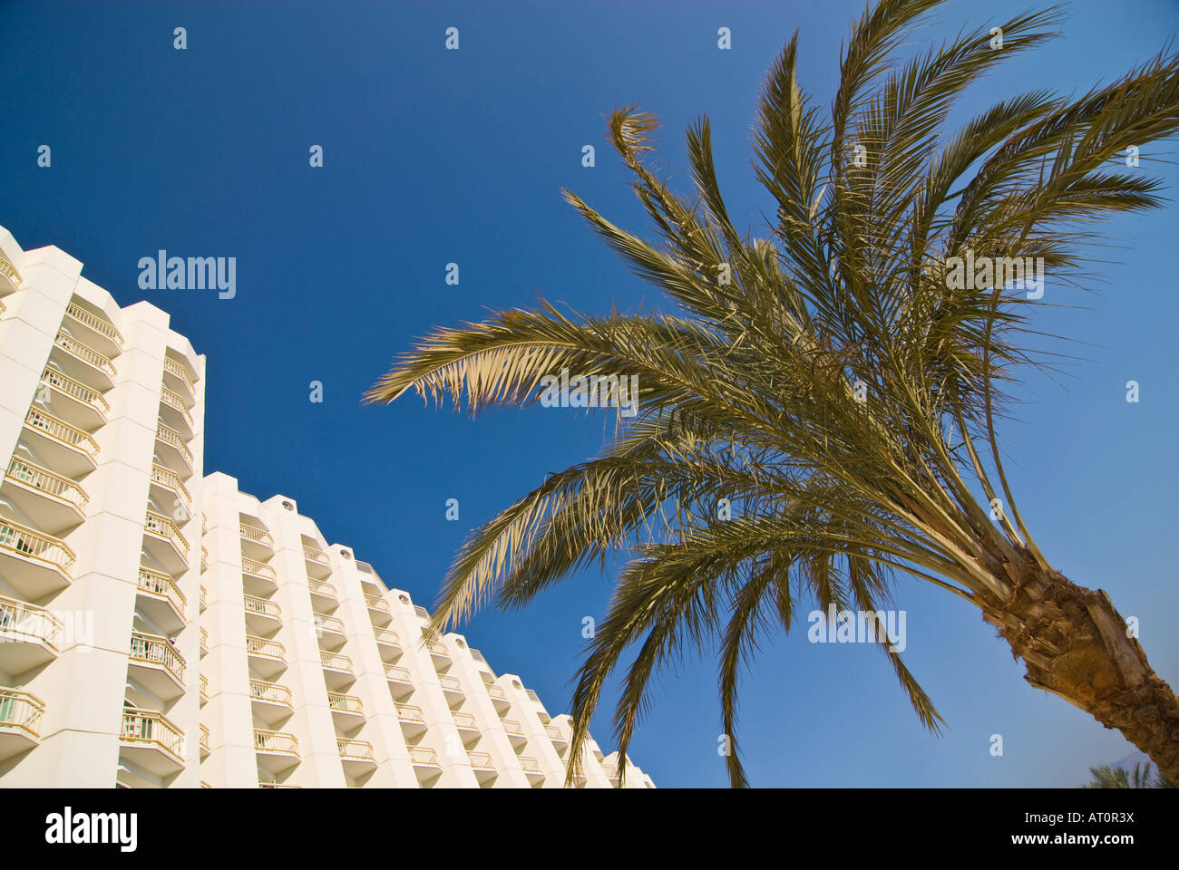 Horizontal wide angle of the front elevation of a white hotel and a ...