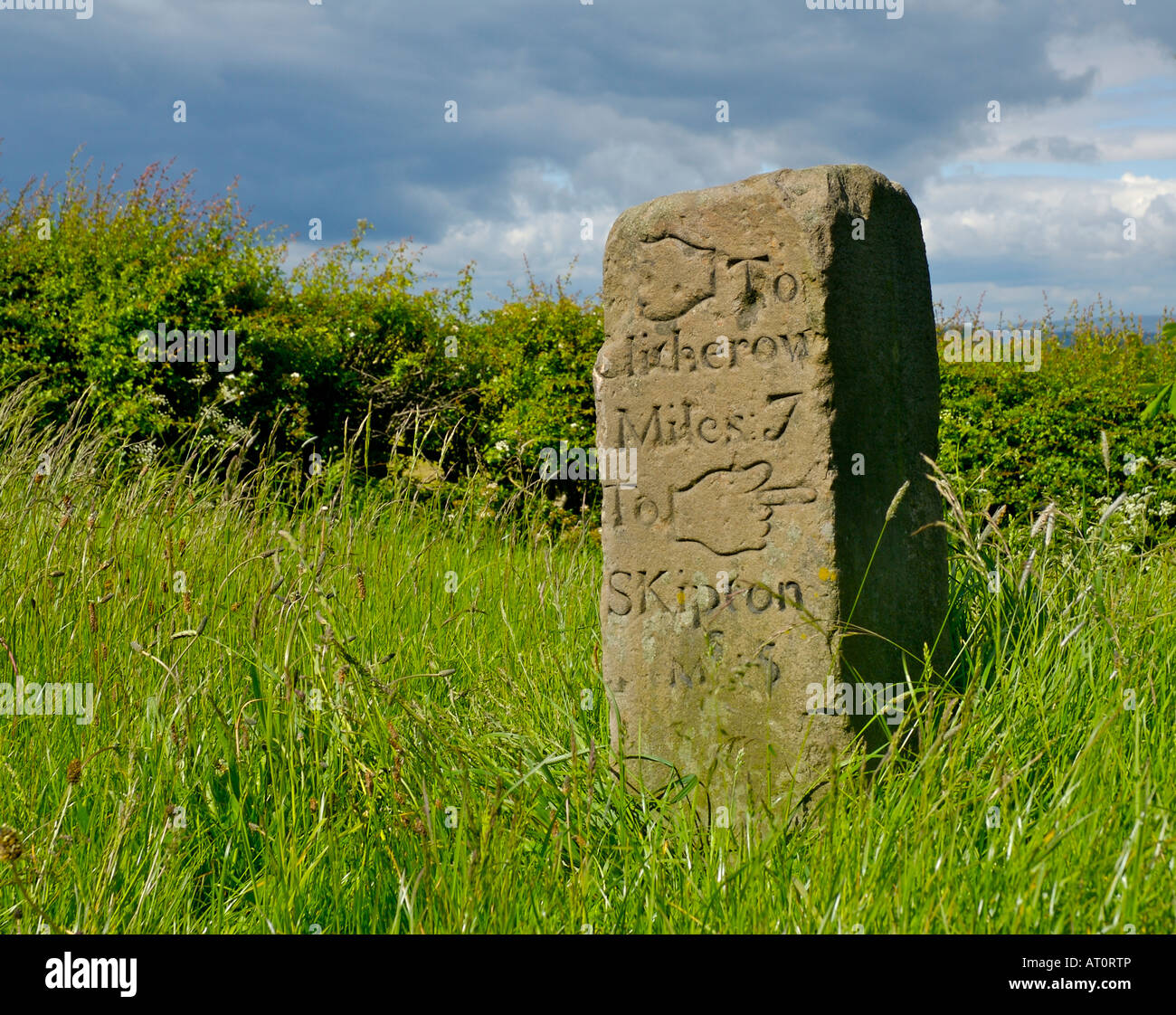 Old milestone showing directions (and mileage) to Skipton and clitheroe ...