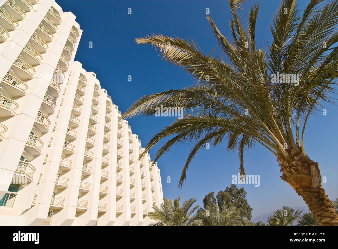 Horizontal wide angle of the front elevation of a white hotel and a ...