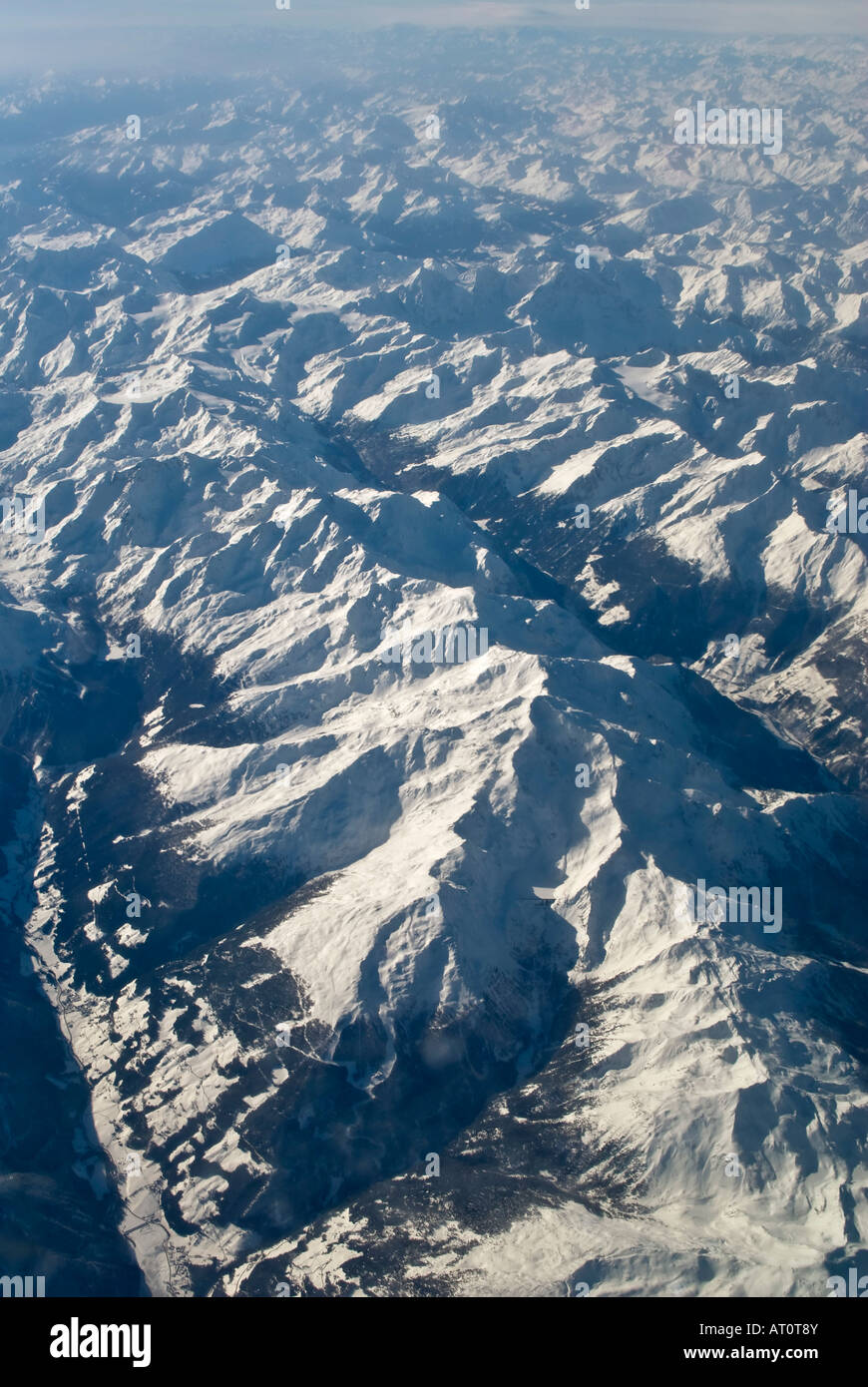 Vertical wide angle of the snow capped peaks of The Alps mountain range ...