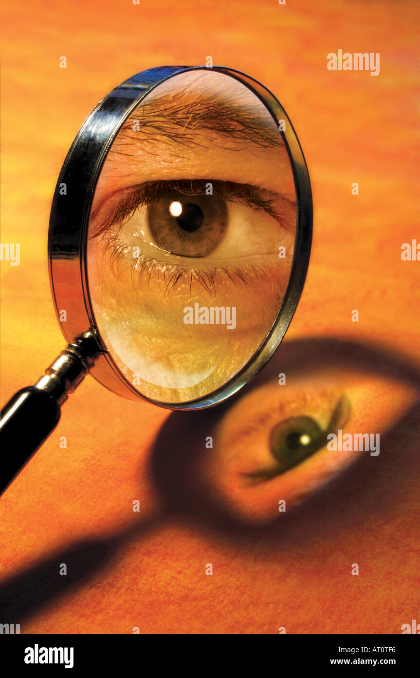 eye enlarged in manifying glass Stock Photo - Alamy