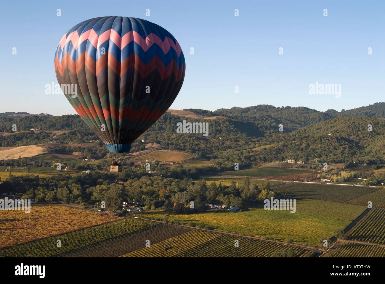 Hot air balloon flies over Napa Valley California Stock Photo - Alamy