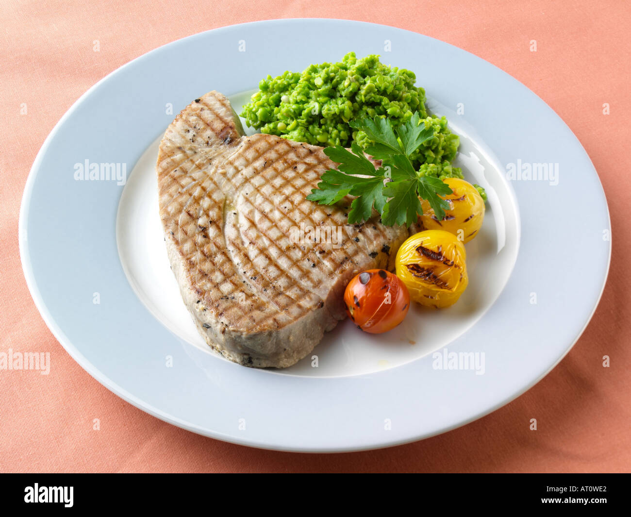 Griddled Tuna steak with mashed broad beans Stock Photo - Alamy