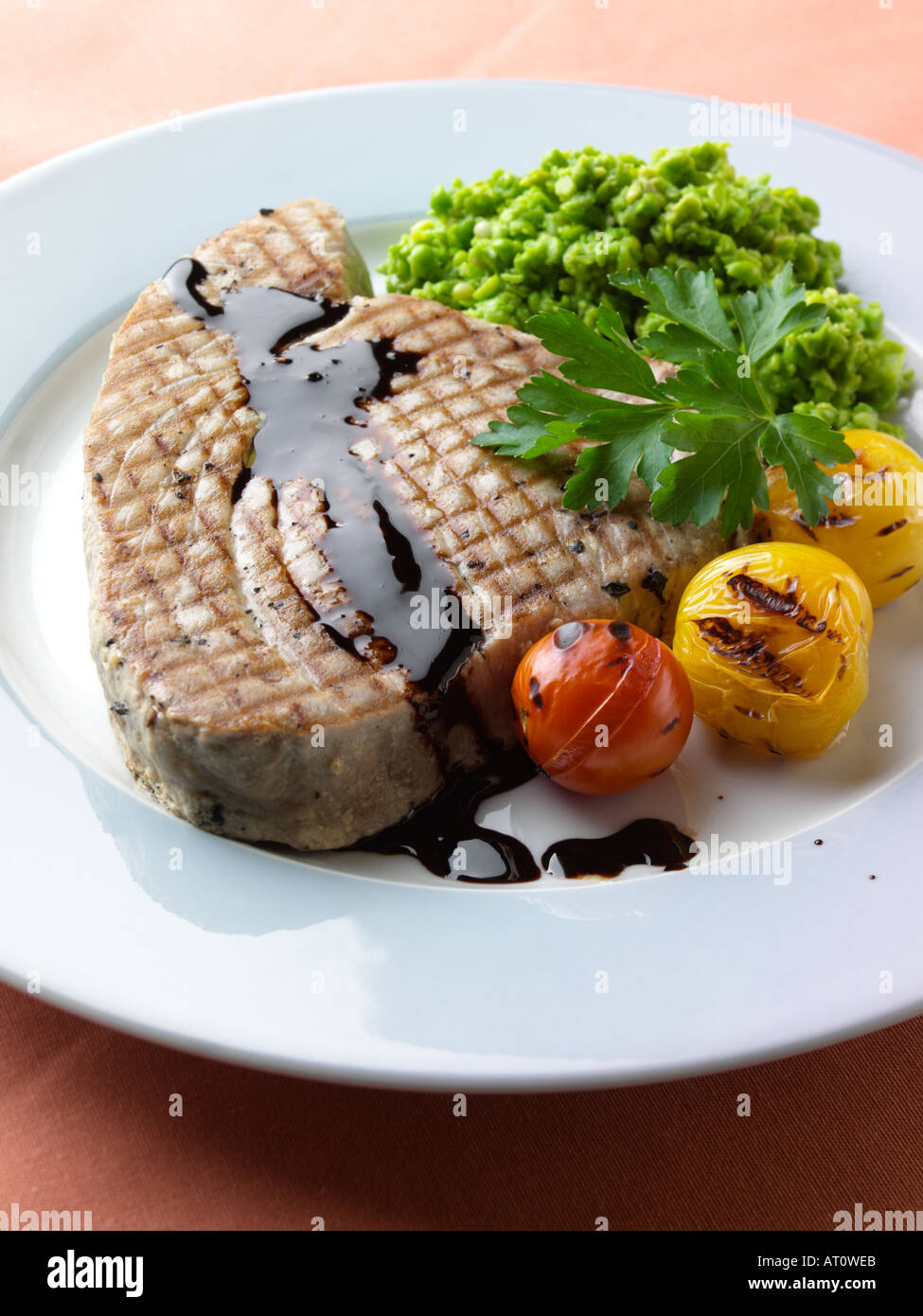 Griddled Tuna steak with mashed broad beans Stock Photo - Alamy