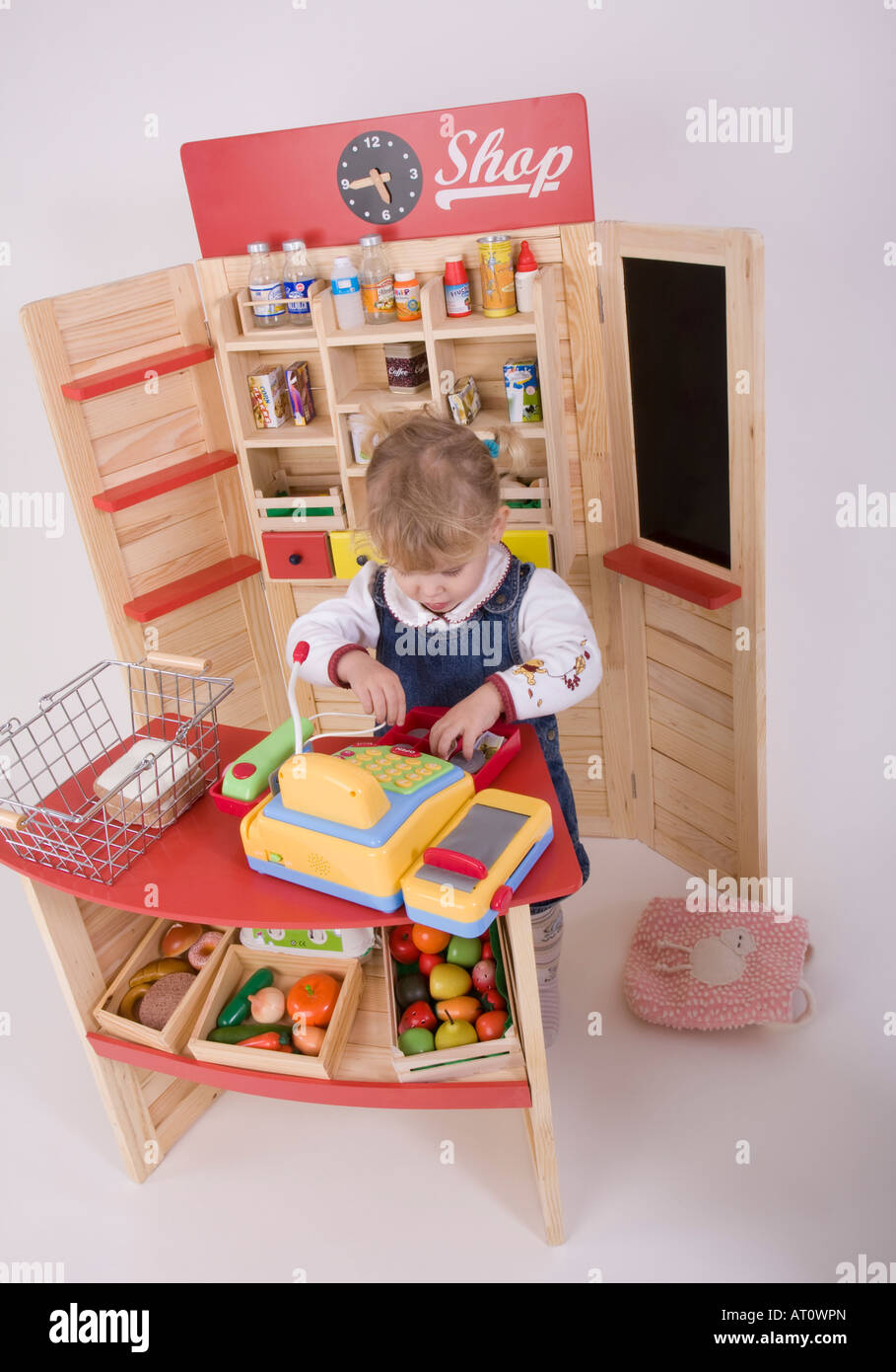 little girl playing in grocery shop for children Stock Photo - Alamy