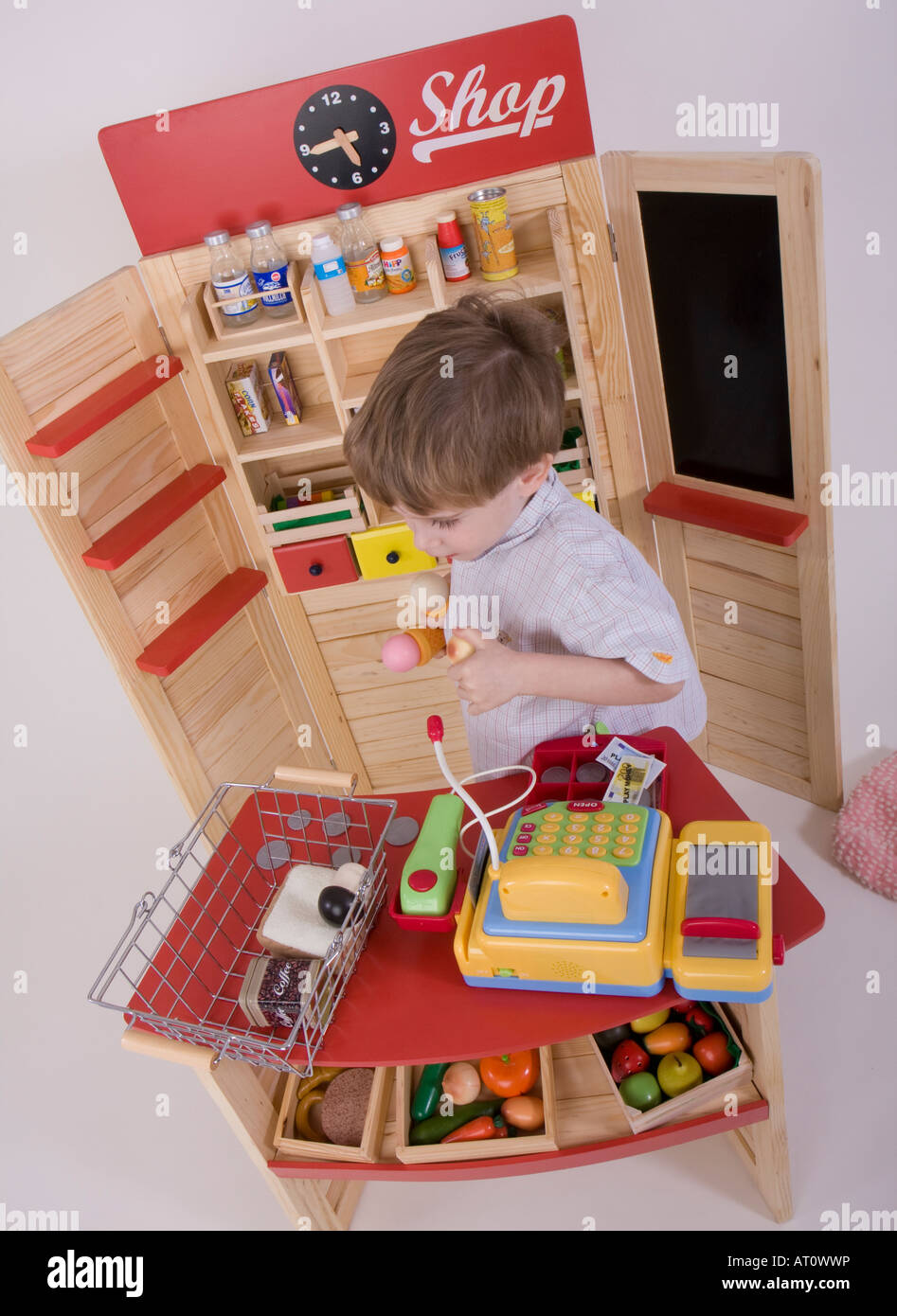 little boy playing in grocery shop for children Stock Photo - Alamy