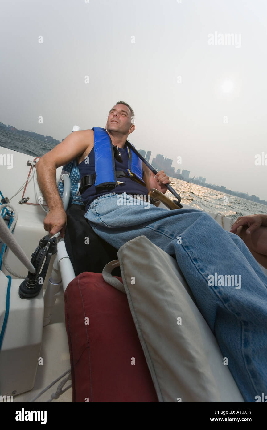 Man with handicap doing disability boat sailing Stock Photo - Alamy