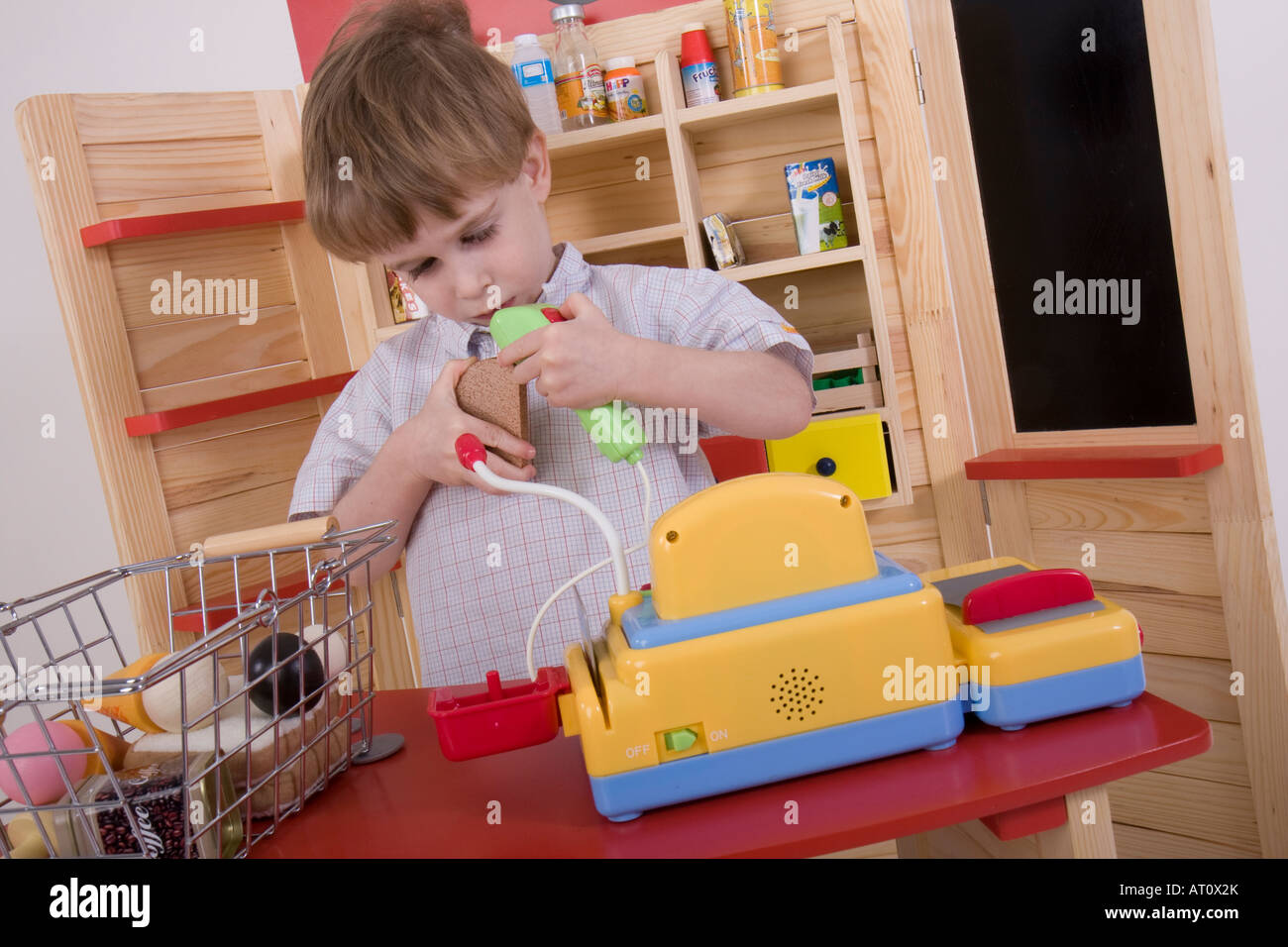 little boy playing in grocery shop for children Stock Photo - Alamy